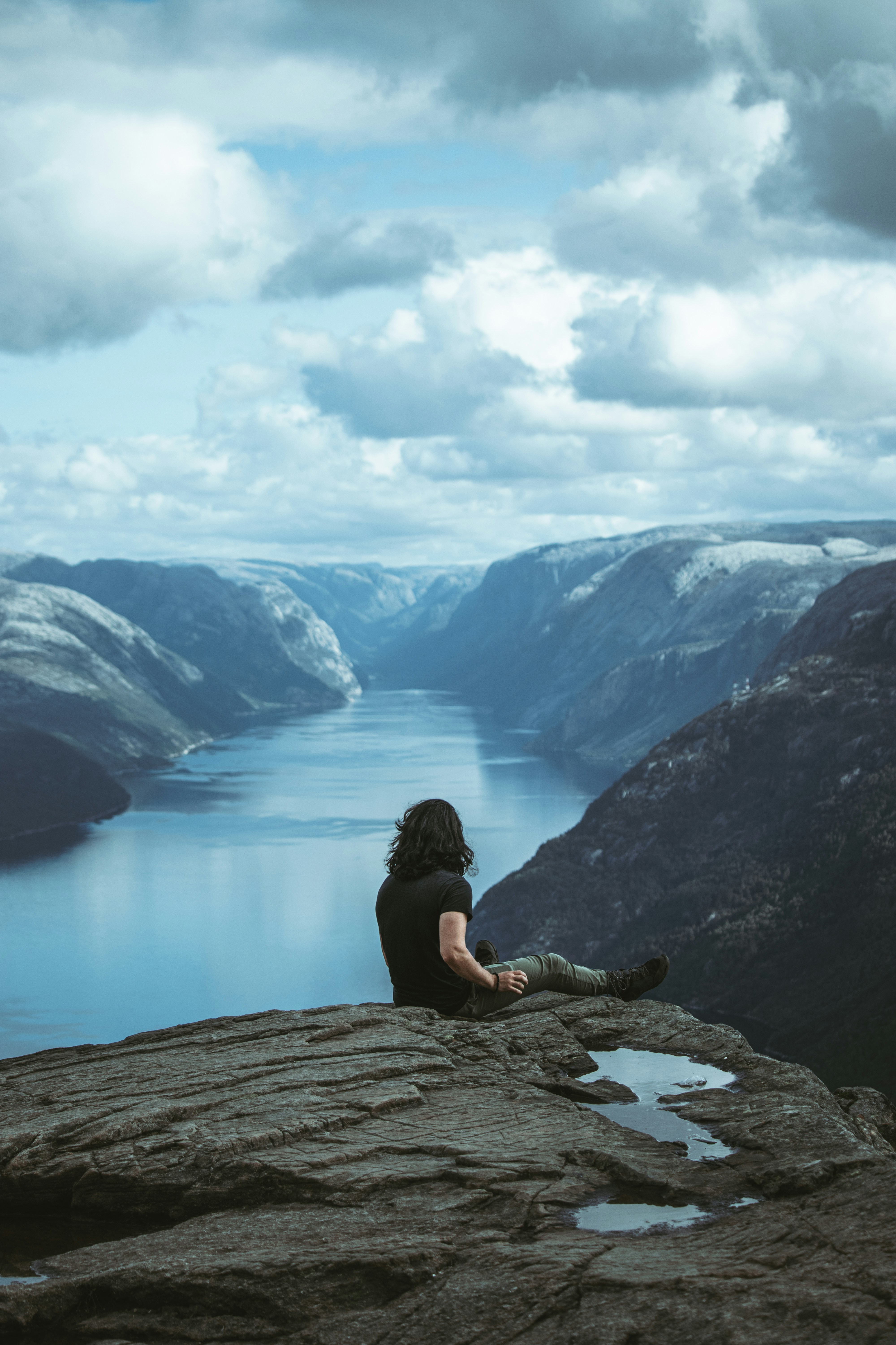 Edge of the Fjord: A Quiet Moment Above the Ice-Blue Depths