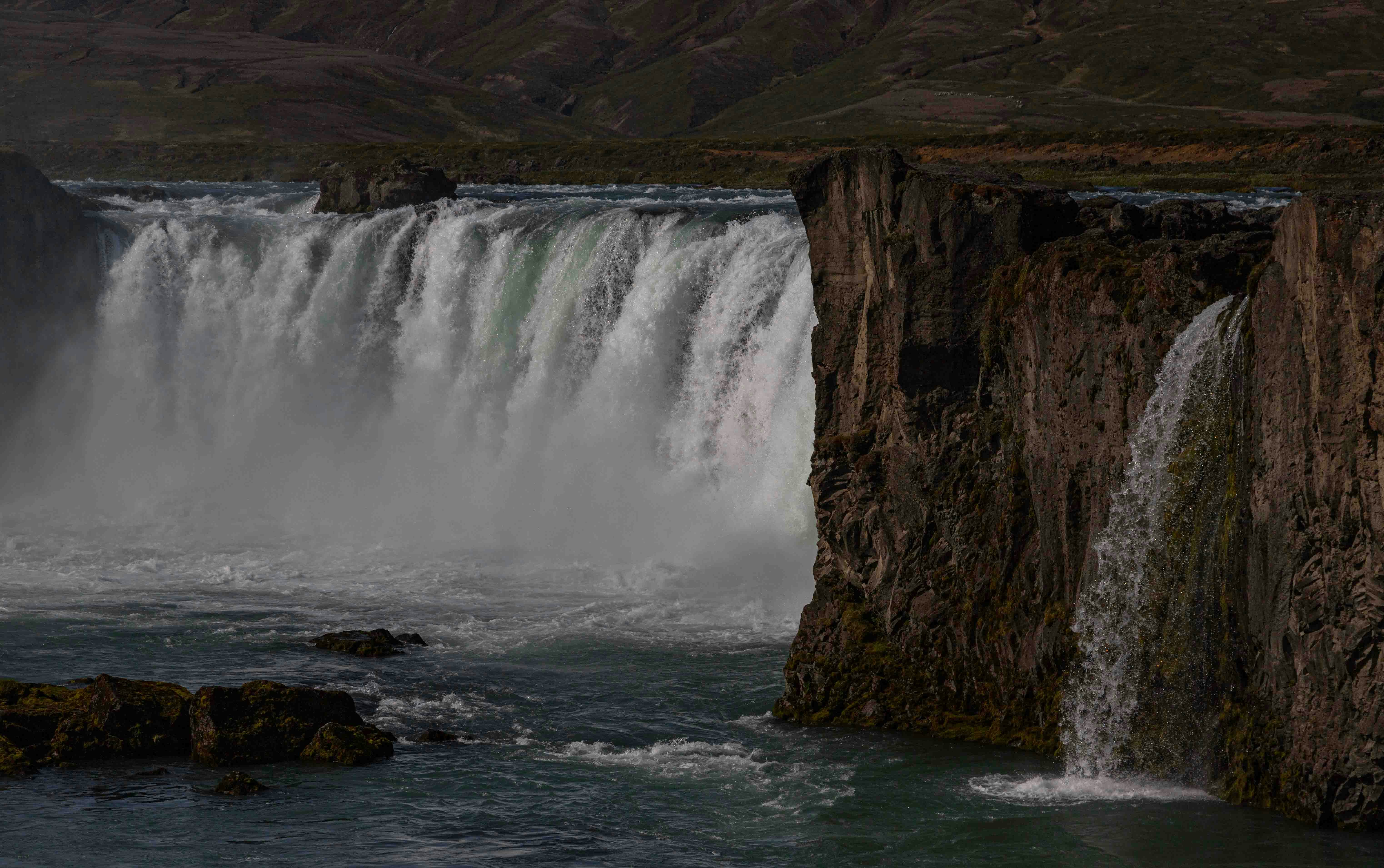 A large waterfall with water coming out of it photo – Free Waterfall ...