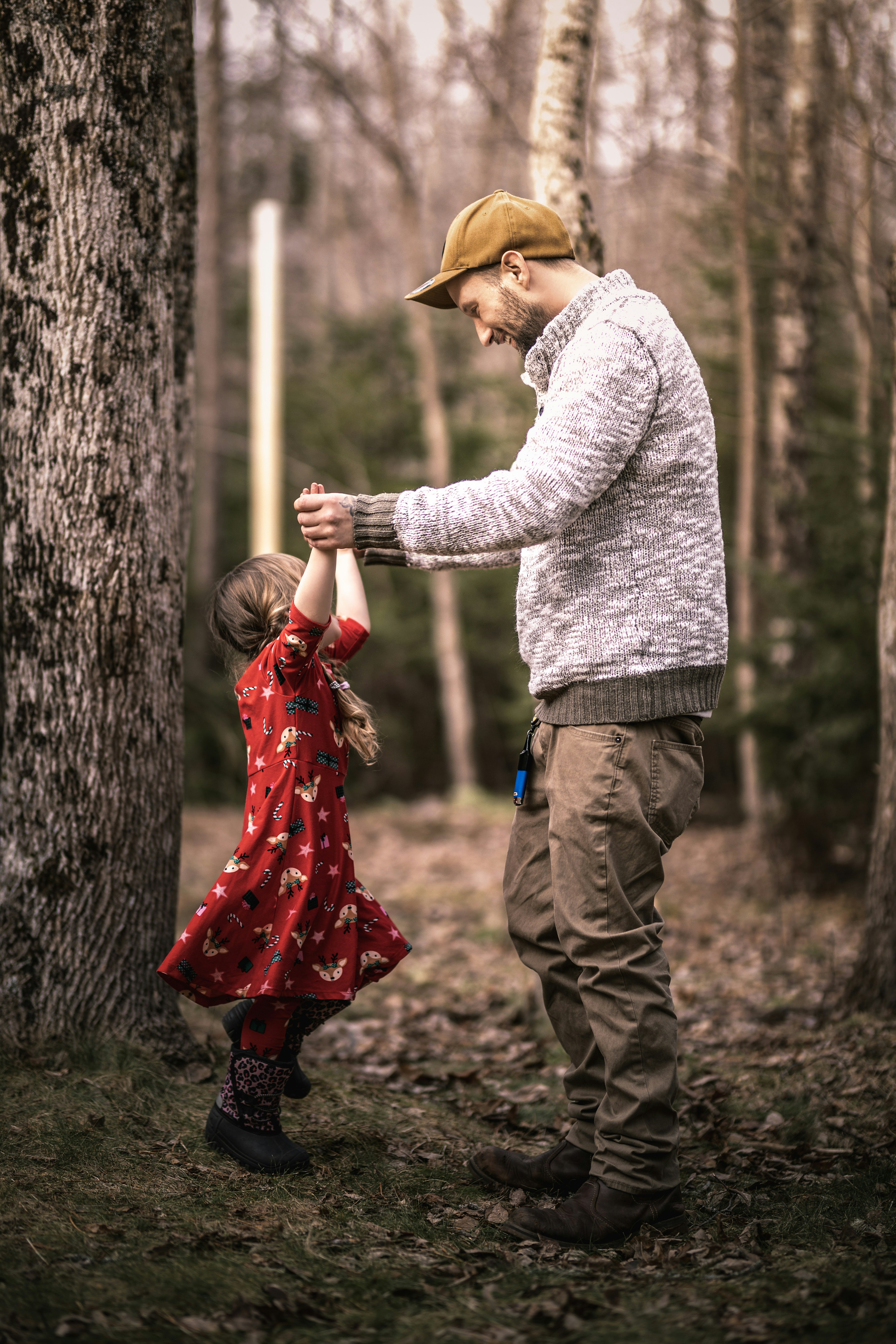 A man and a little girl playing in the woods photo – Free Forest Image ...