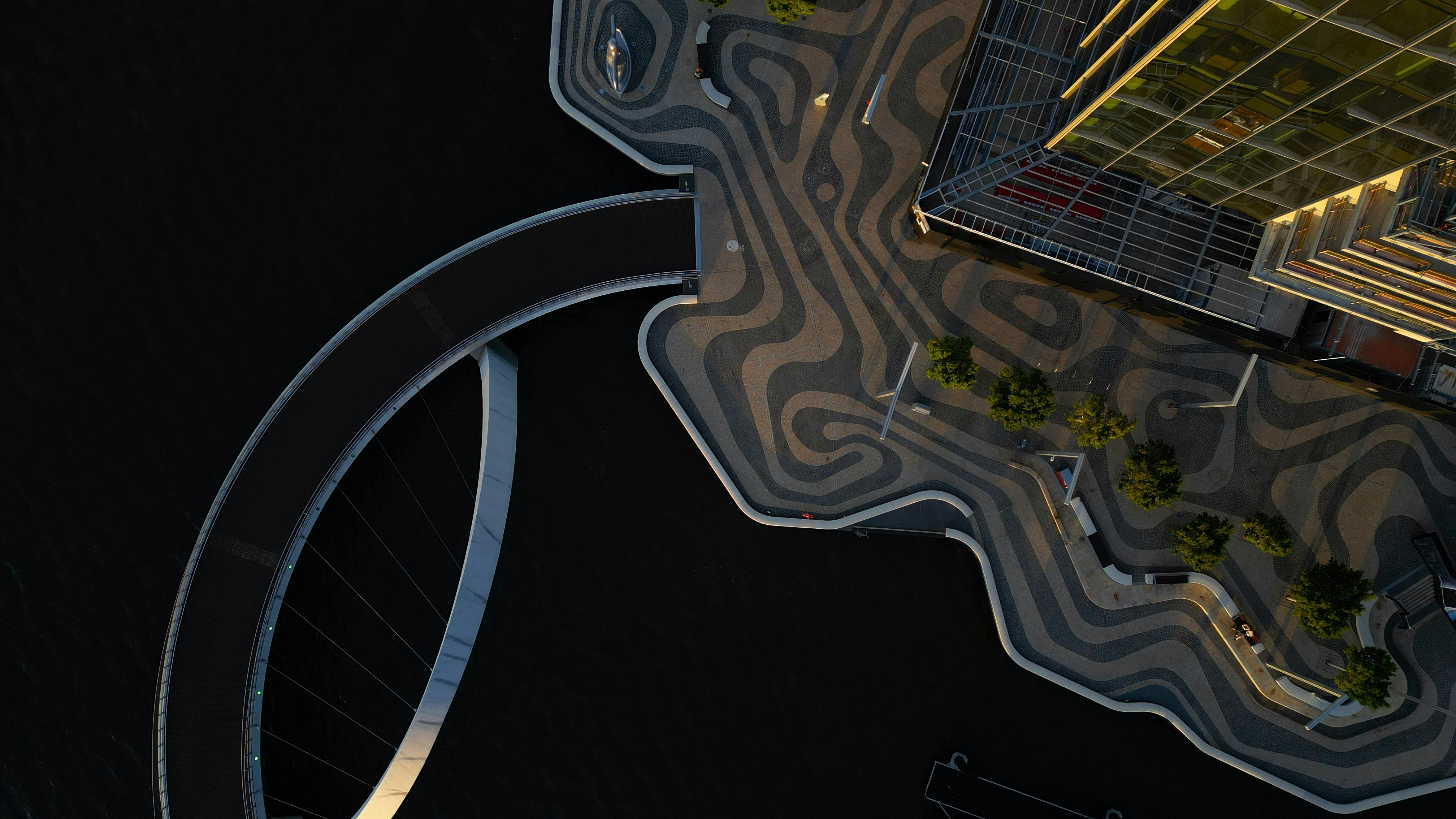 Curvature Over Water: Aerial Study of a Wave-Patterned Waterfront