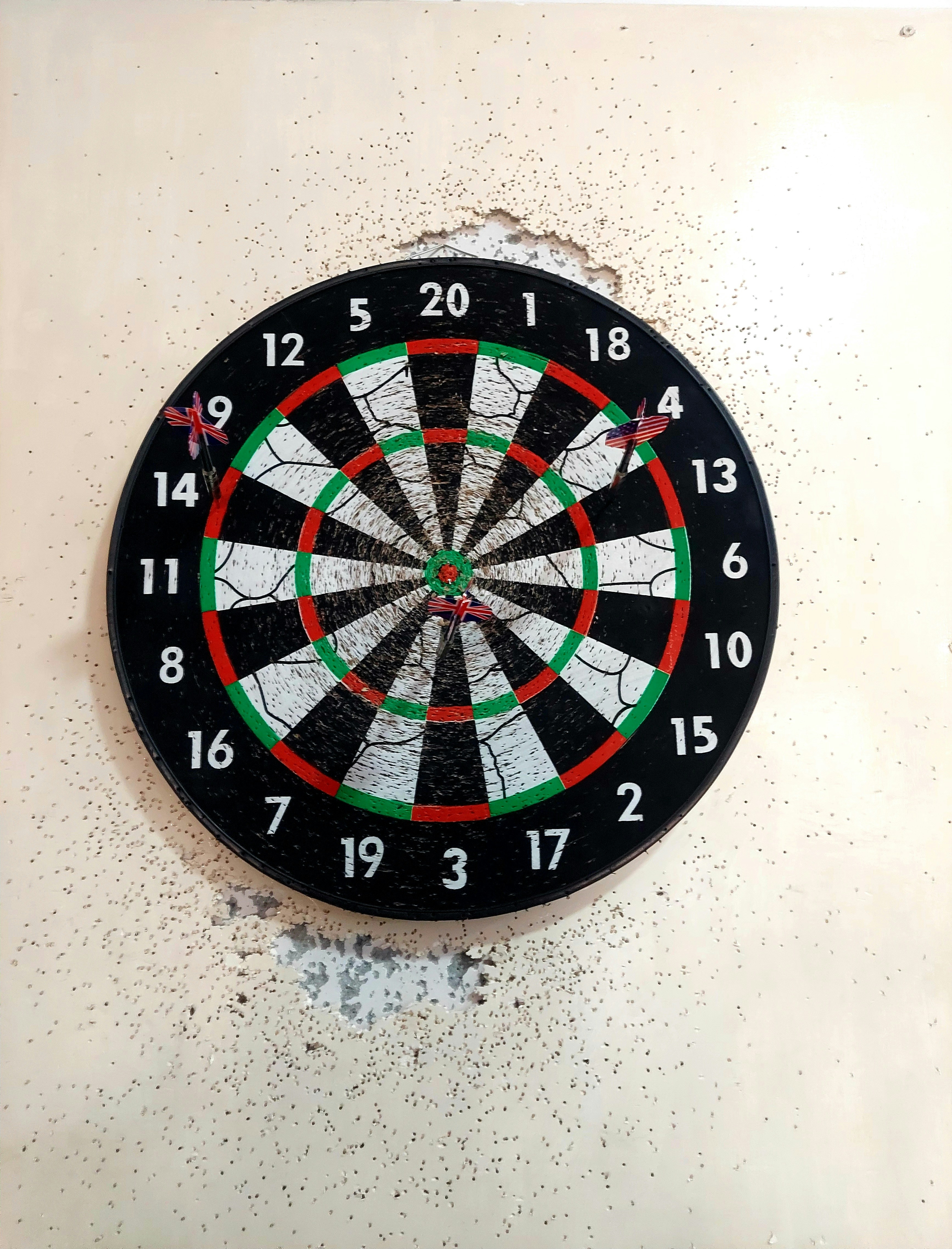 A close up of a dart on a wall photo – Free Game Image on Unsplash