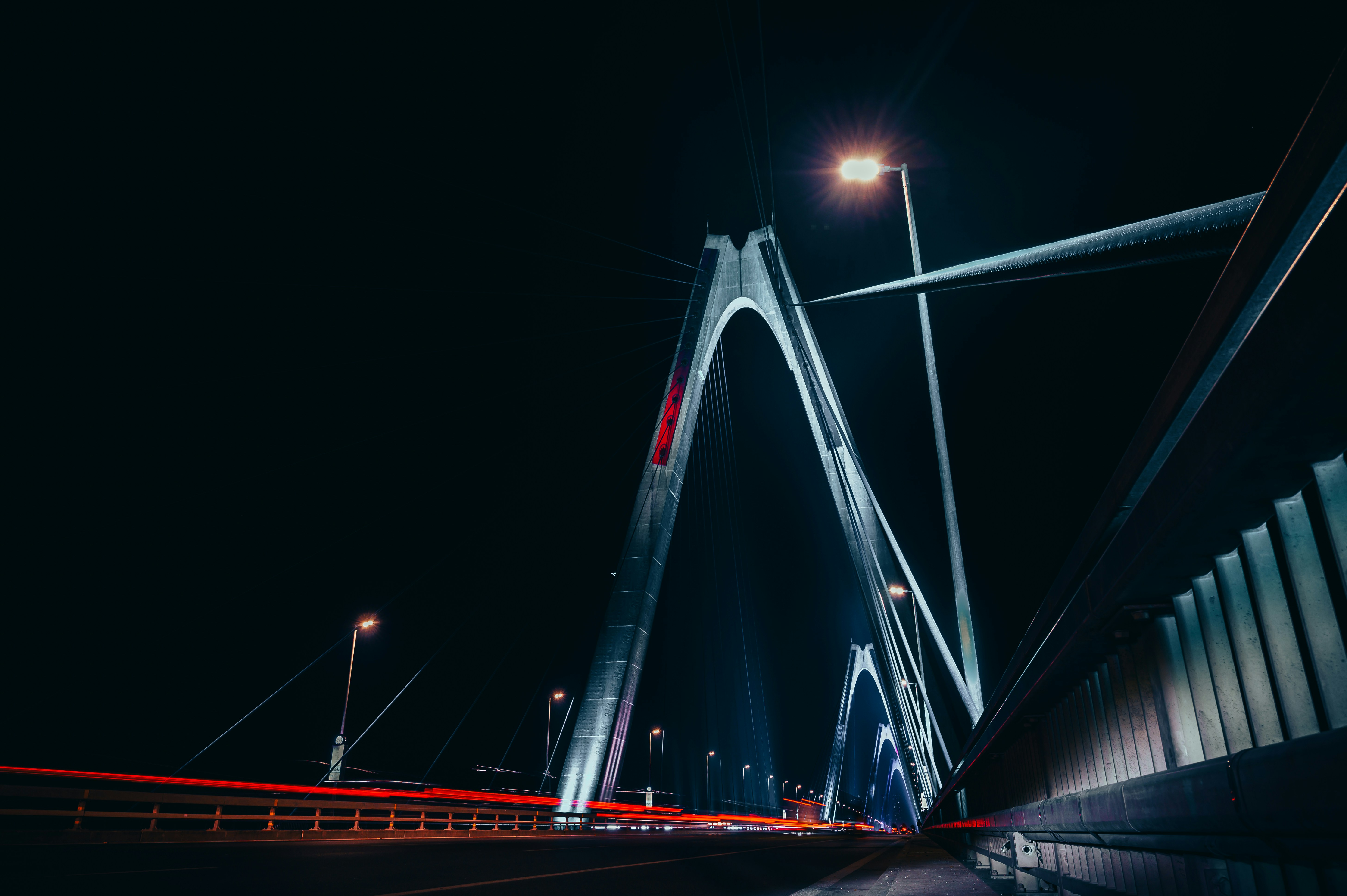 Illuminated Arches: A Nighttime Bridge Perspective