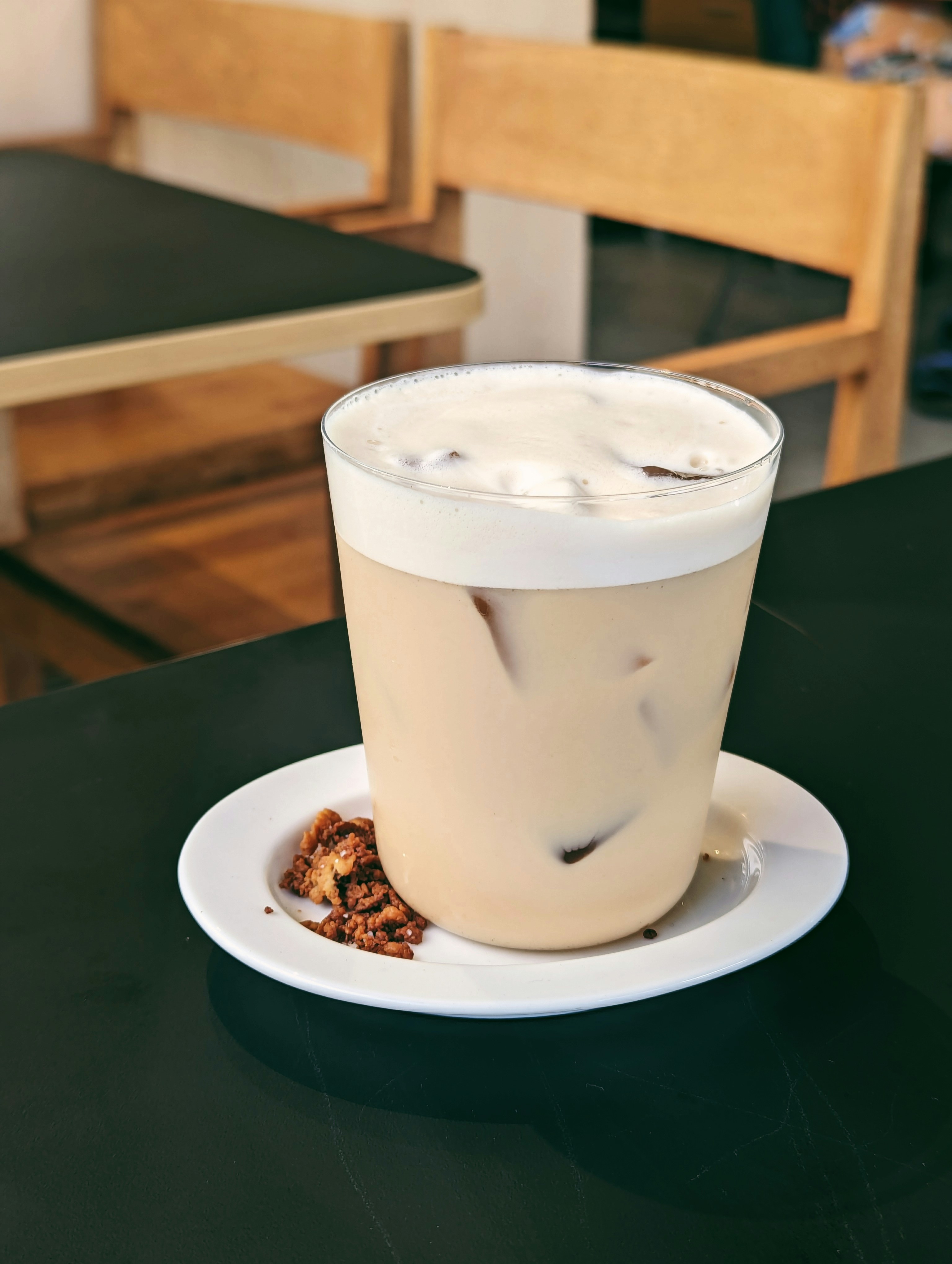 Creamy Iced Latte as Quiet Centerpiece in a Café Scene