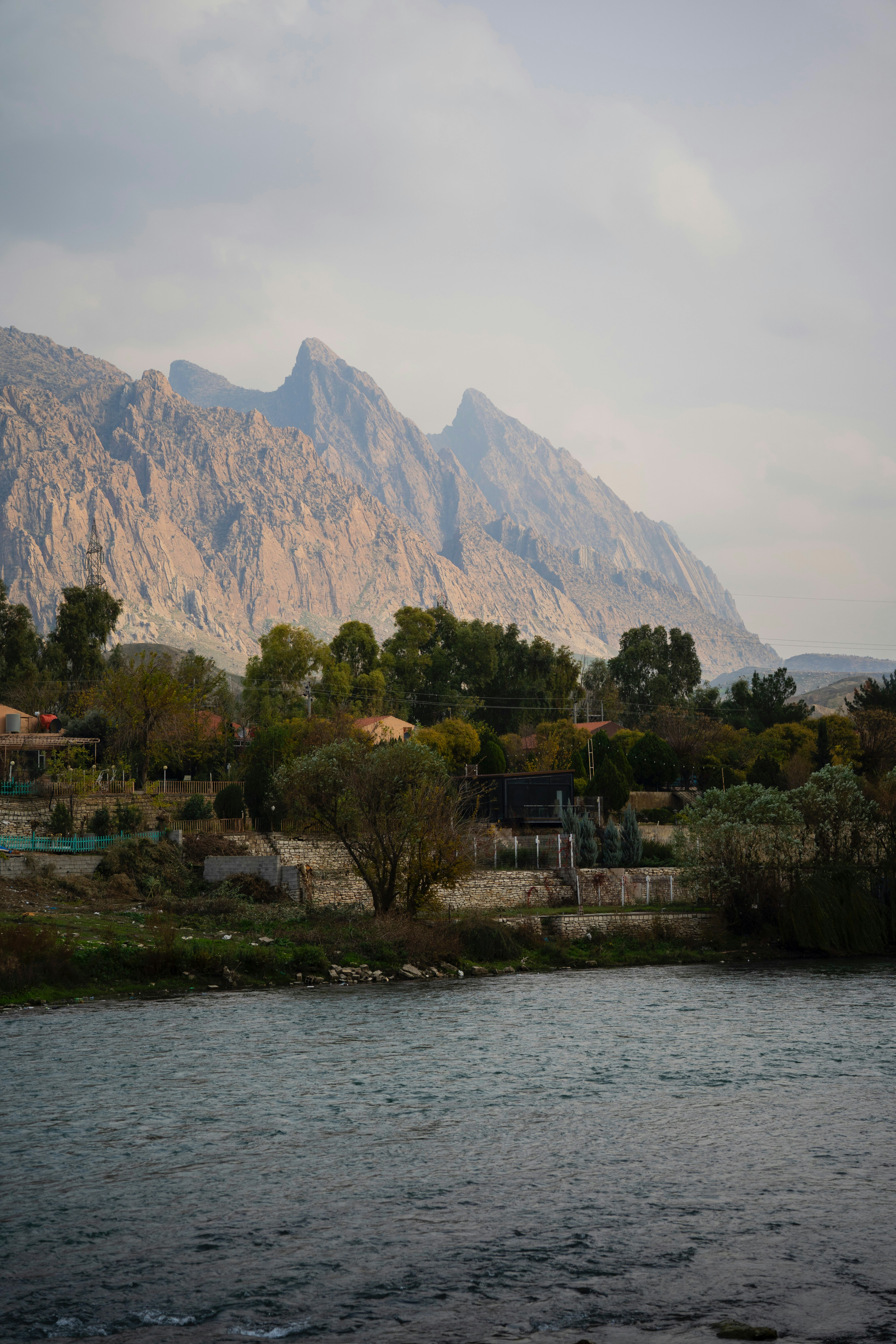 Granite Ridge Over a Quiet Riverside Village