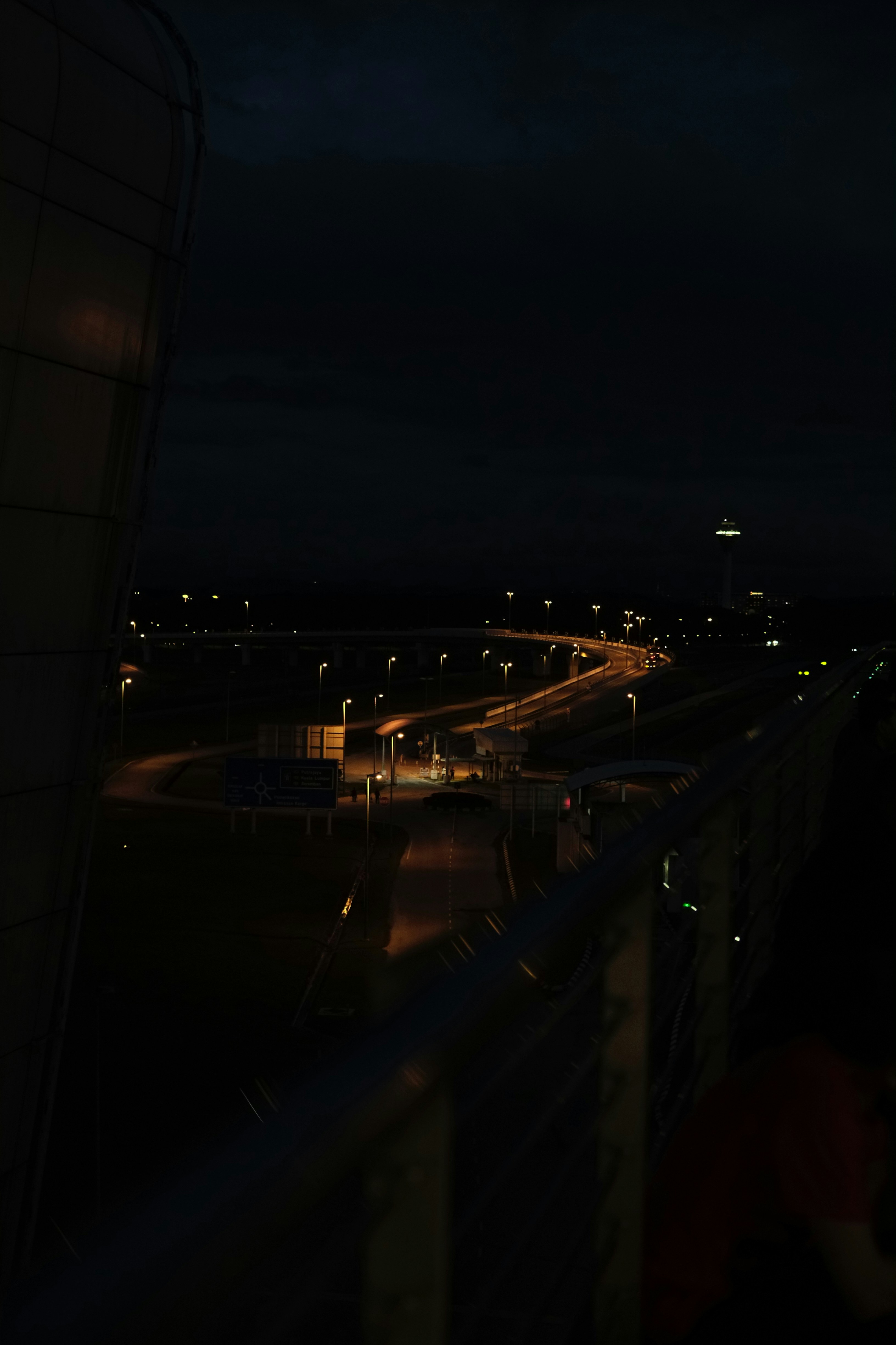 Nocturnal Curve: Warm Streetlight Arches on a Quiet Bridge