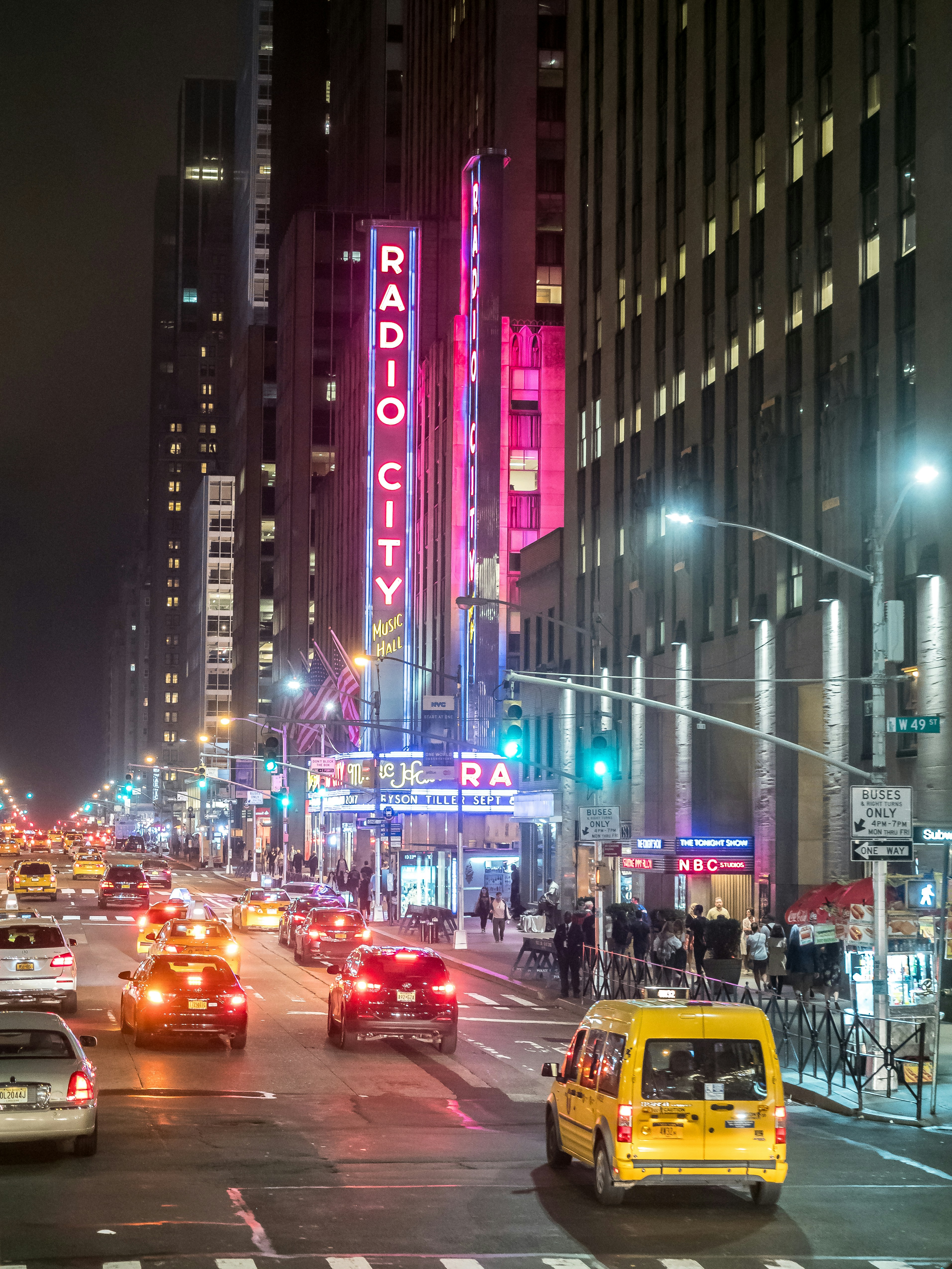 Radio City Neon Tower Above a Thrumming Midtown Night