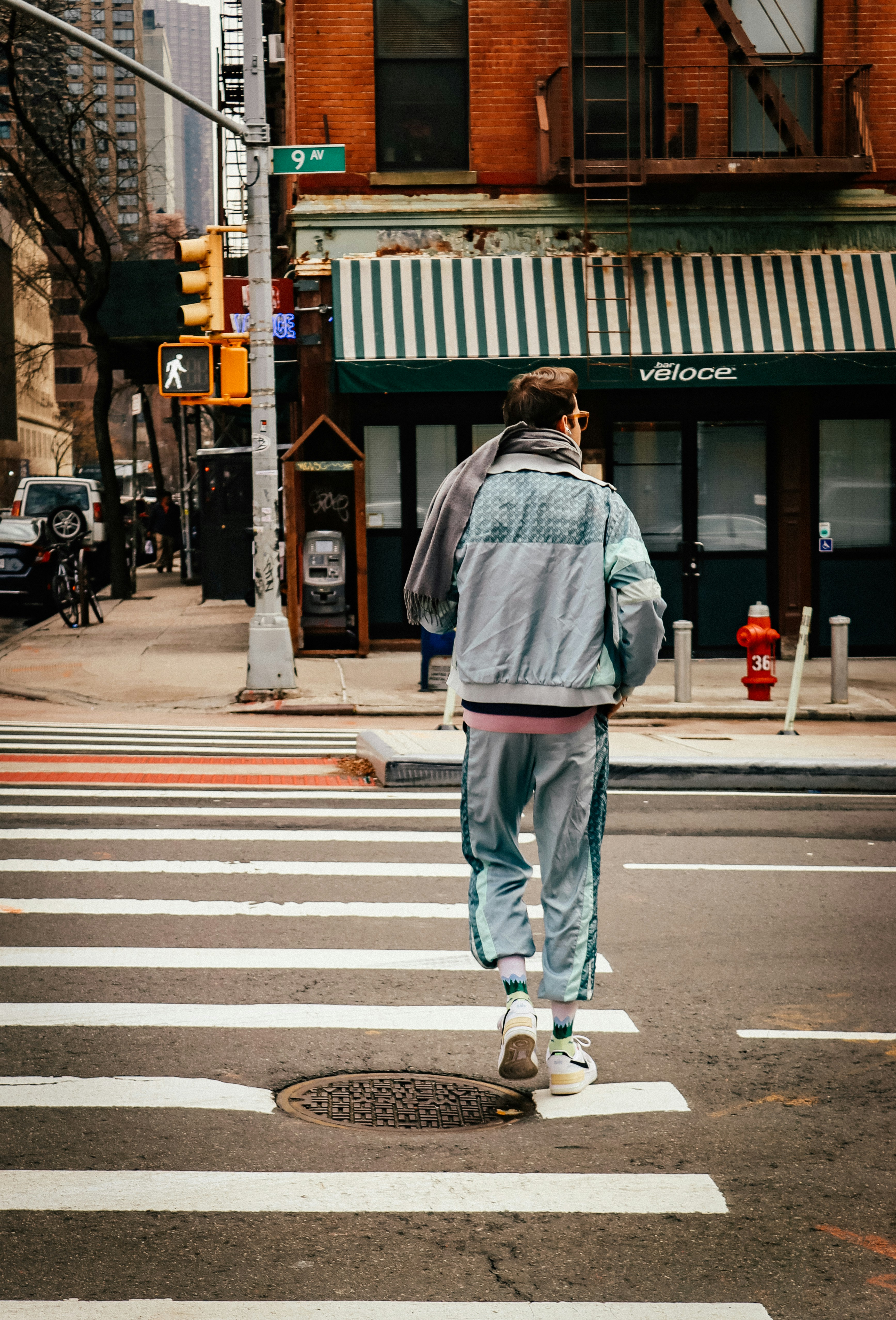 Pastel Tracksuit Crossing: A Quiet City Moment at the Crosswalk