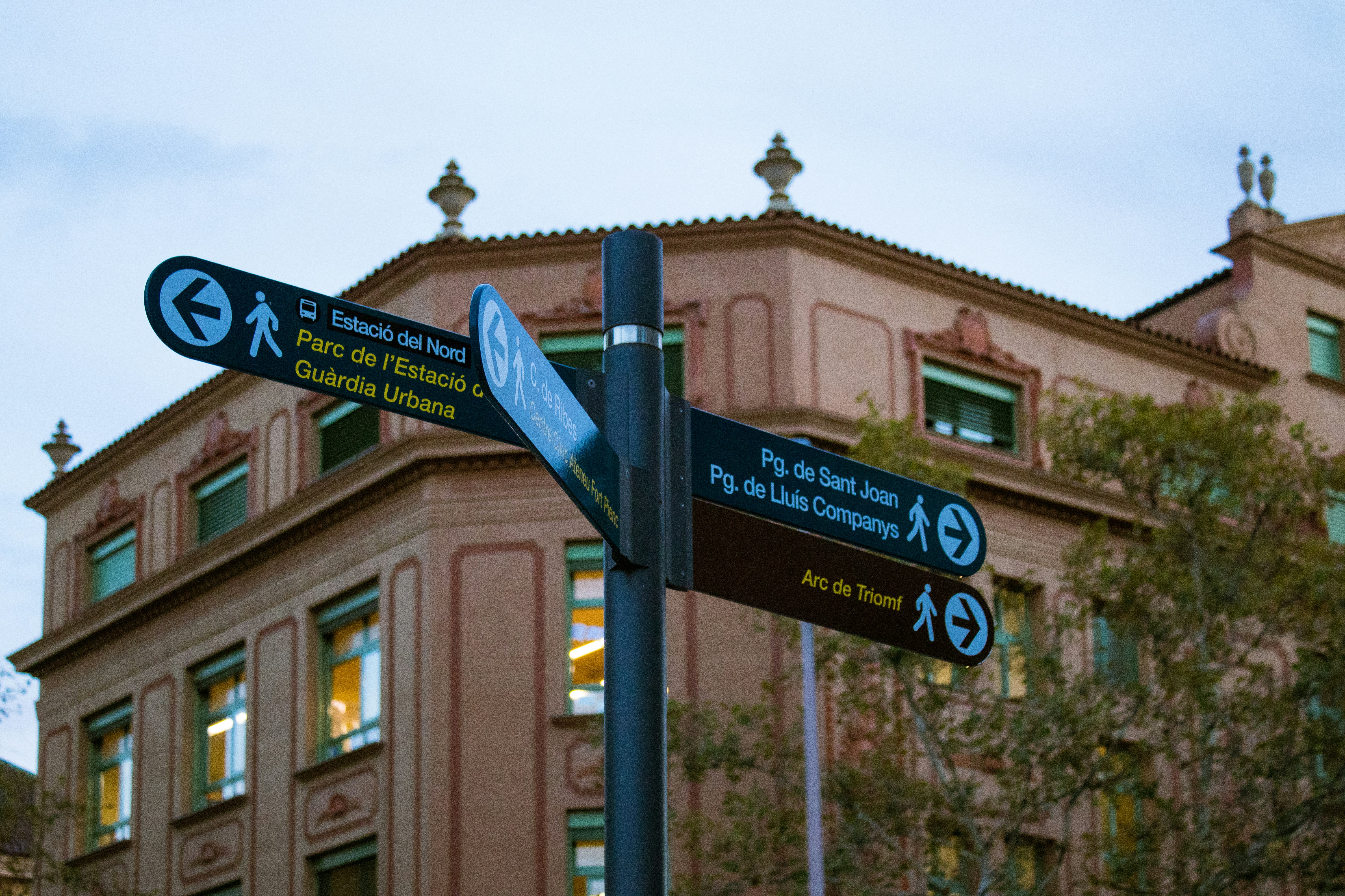 Corner Signpost Echoes Through Madrid-Style Facade
