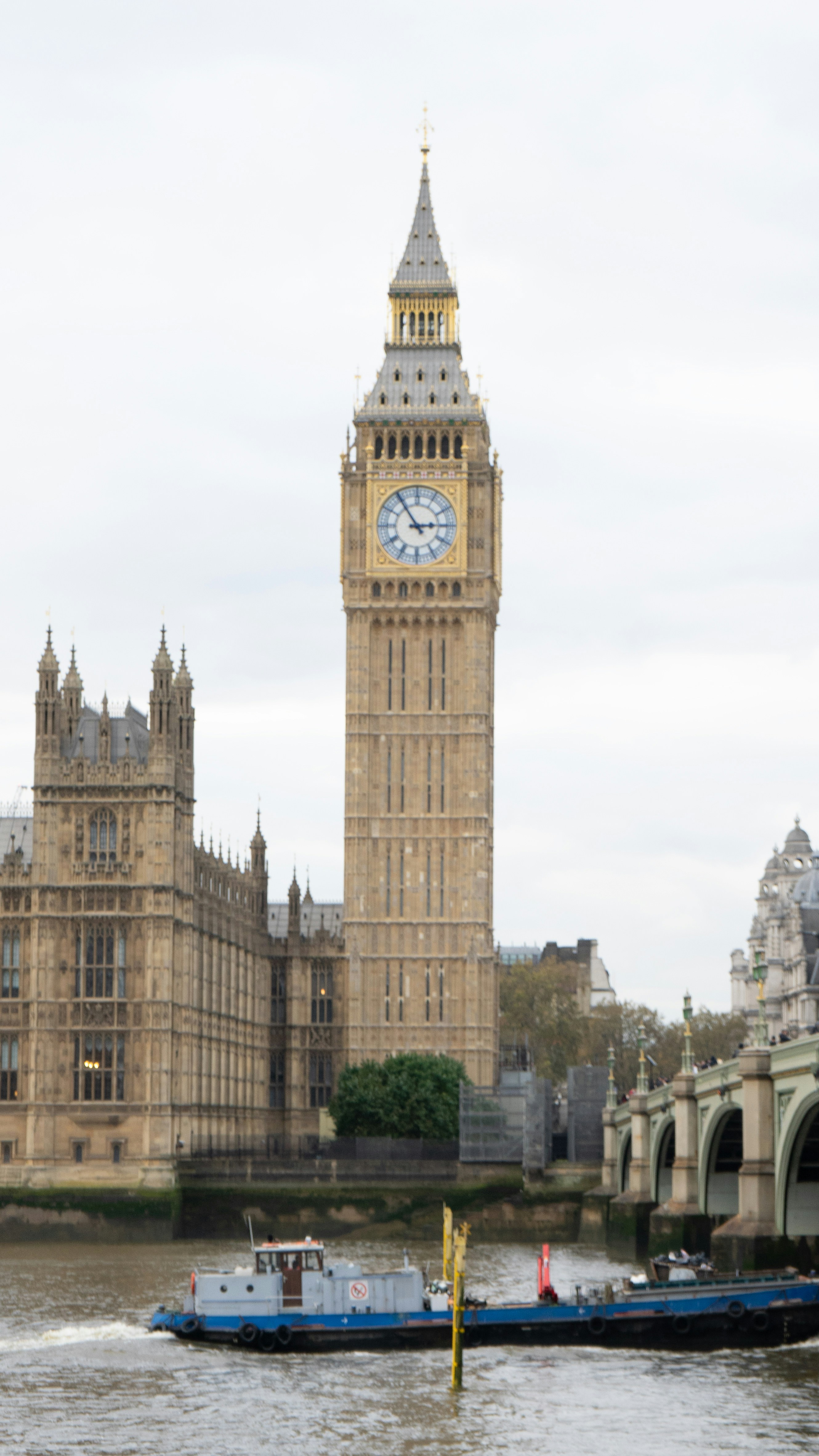A large clock tower towering over the city of london photo – Free ...