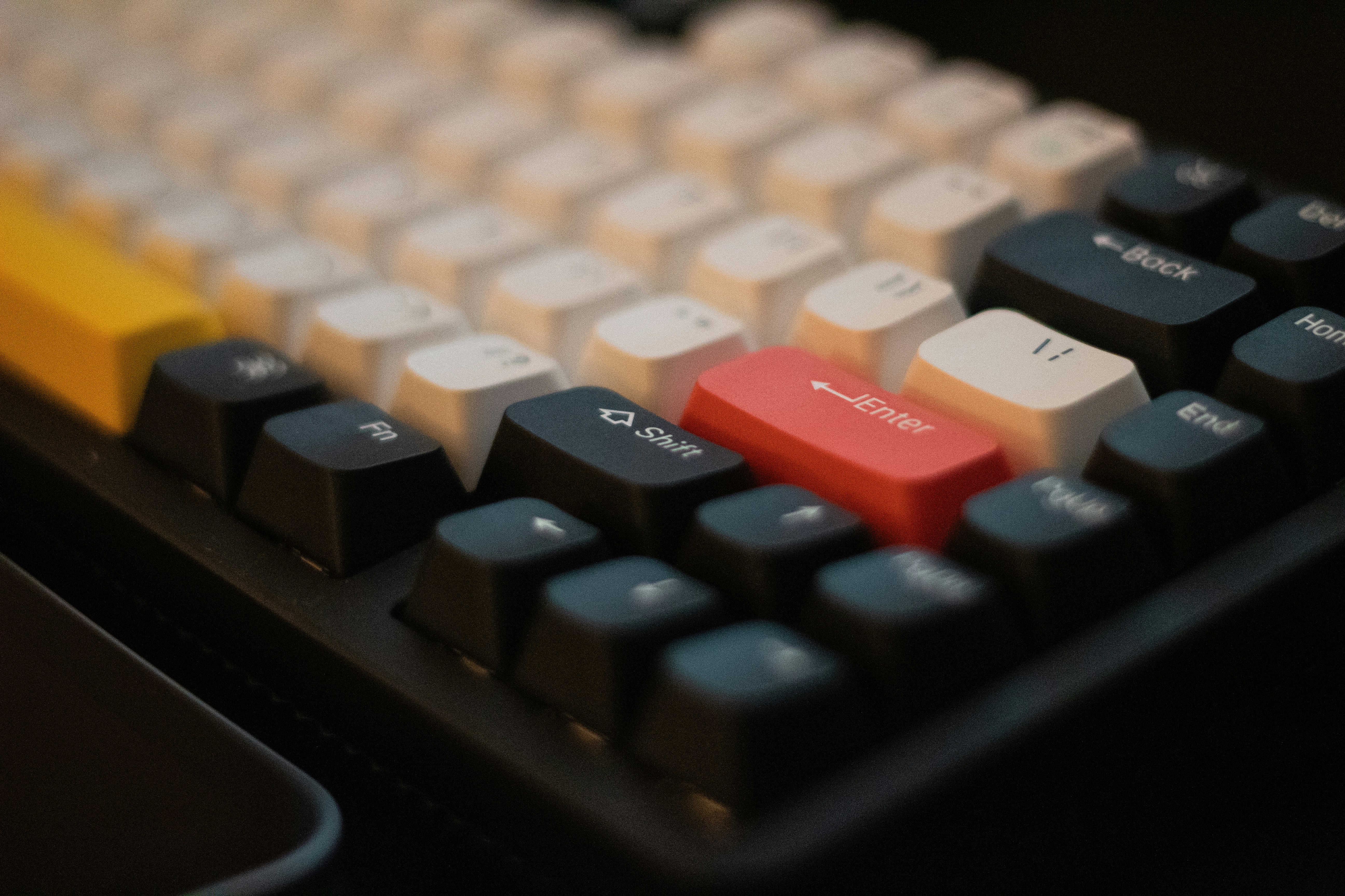 A close up of a computer keyboard with colored keys photo – Free ...