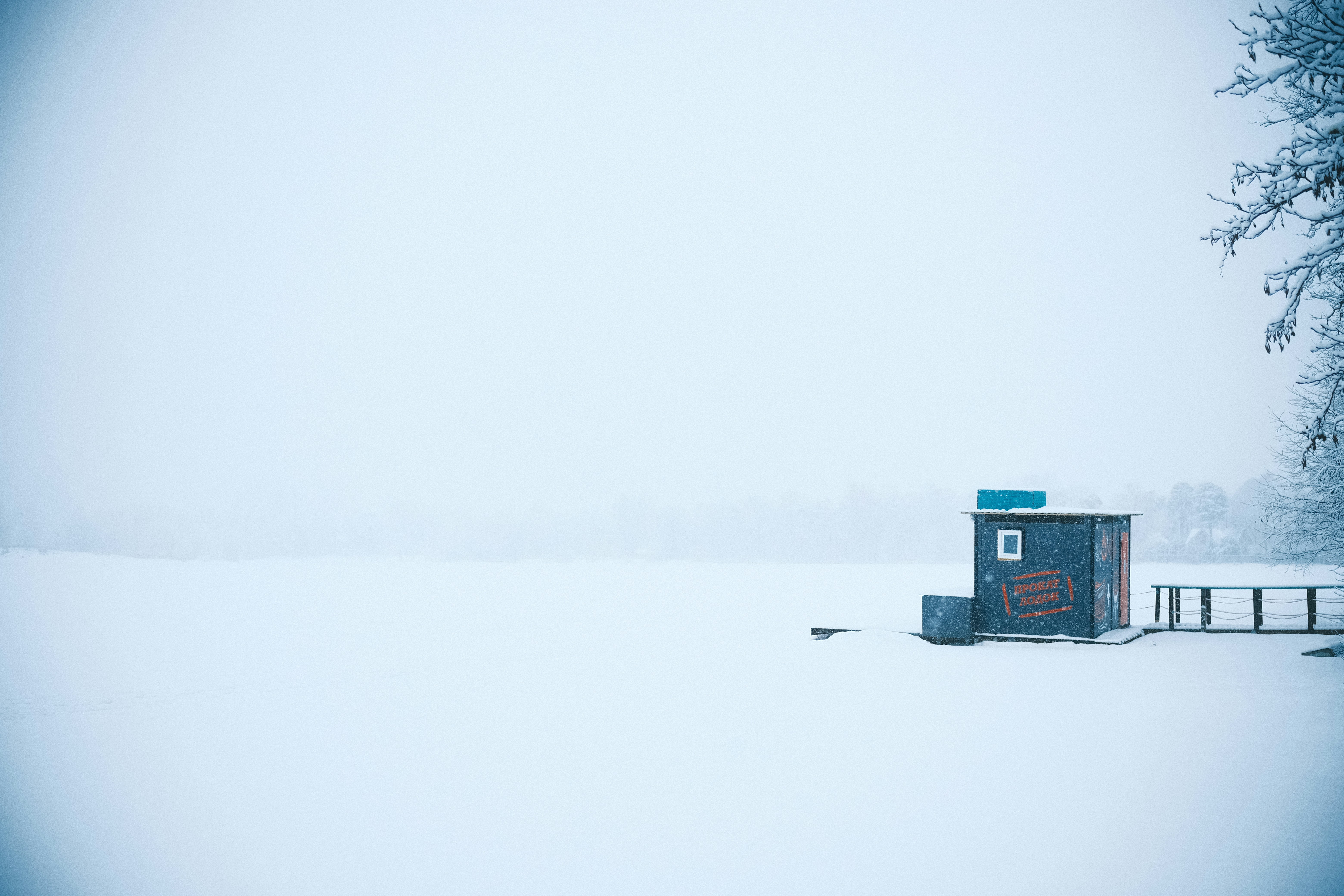 Bleached Outpost at the Edge of a Misty Snowfield