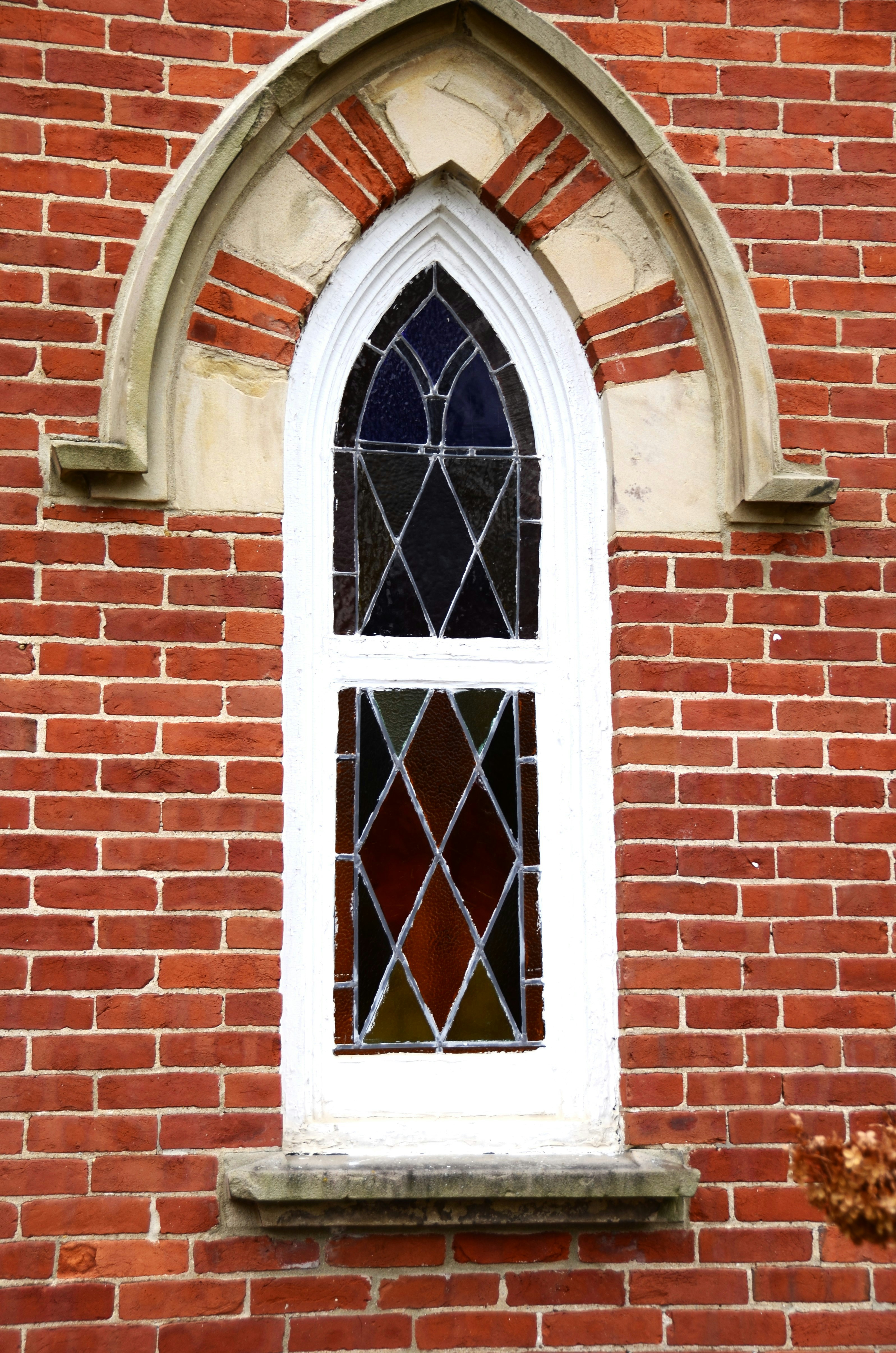 Arched stained glass church window
