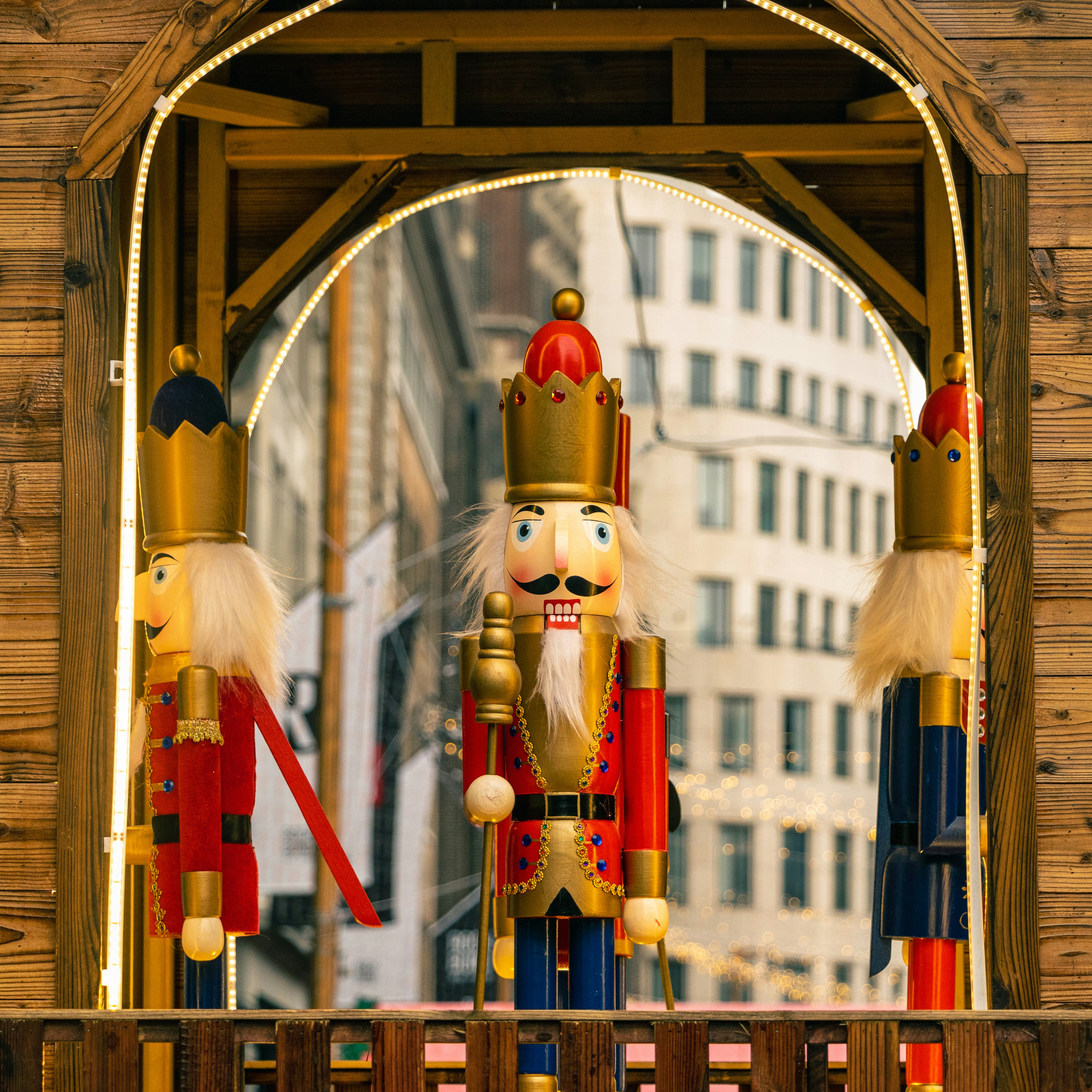 A group of nutcrackers that are standing in front of a window photo ...