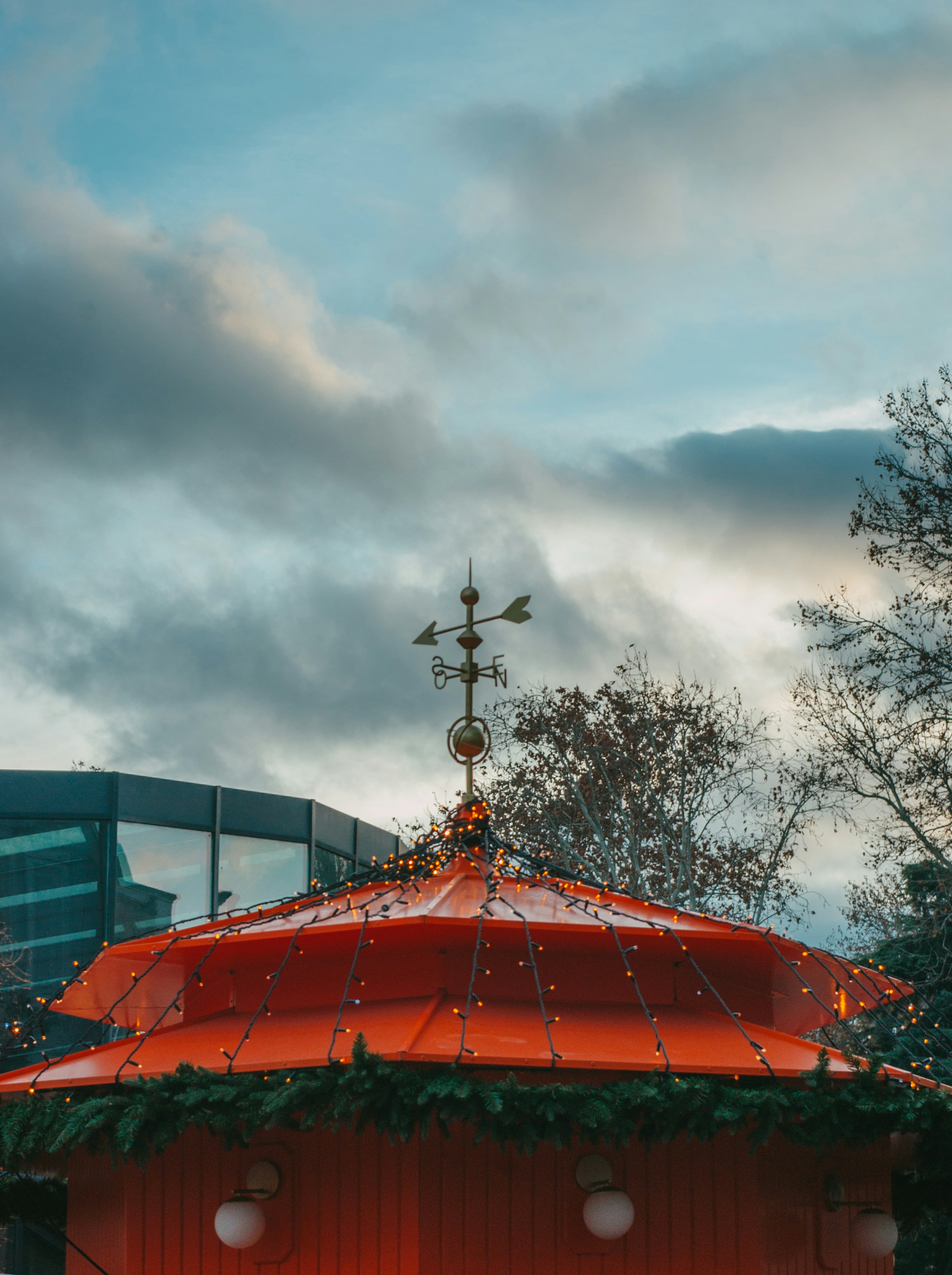 A red building with a weather vane on top of it photo – Free Shelter ...
