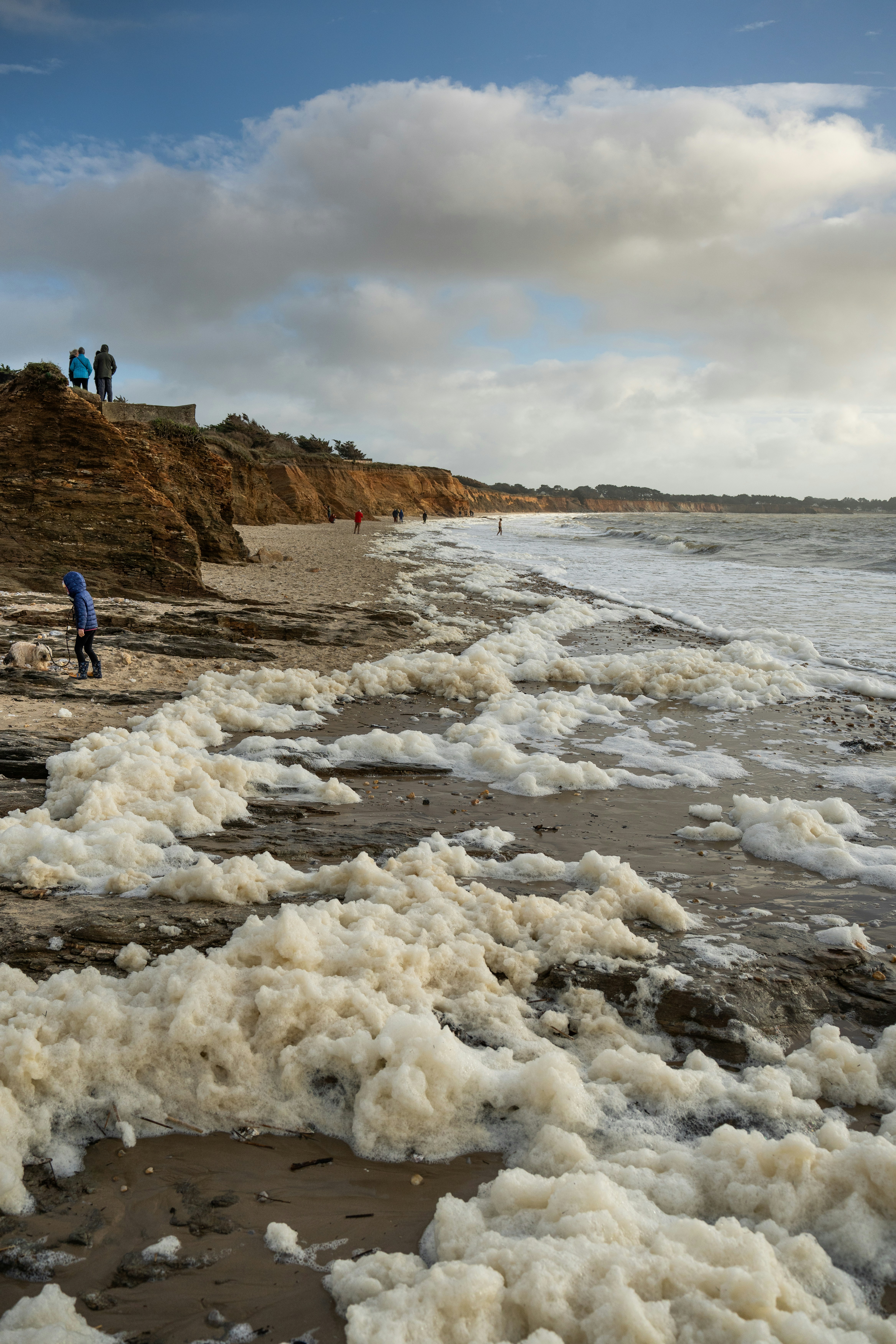 Cliffs and Foam: Figures on a Windy Coastal Walk