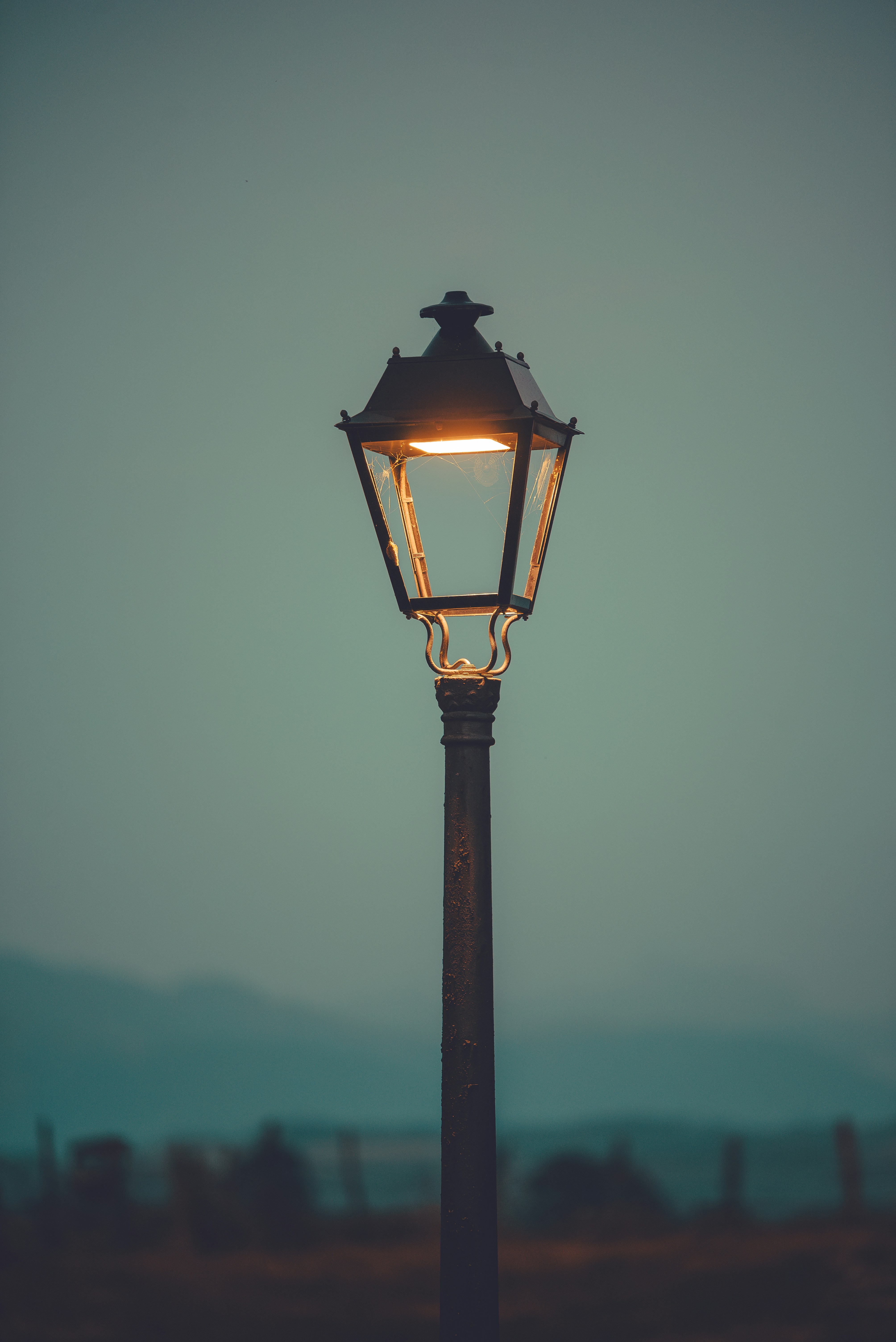 A lamp post with a light on top of it photo – Free Relax streetlight ...
