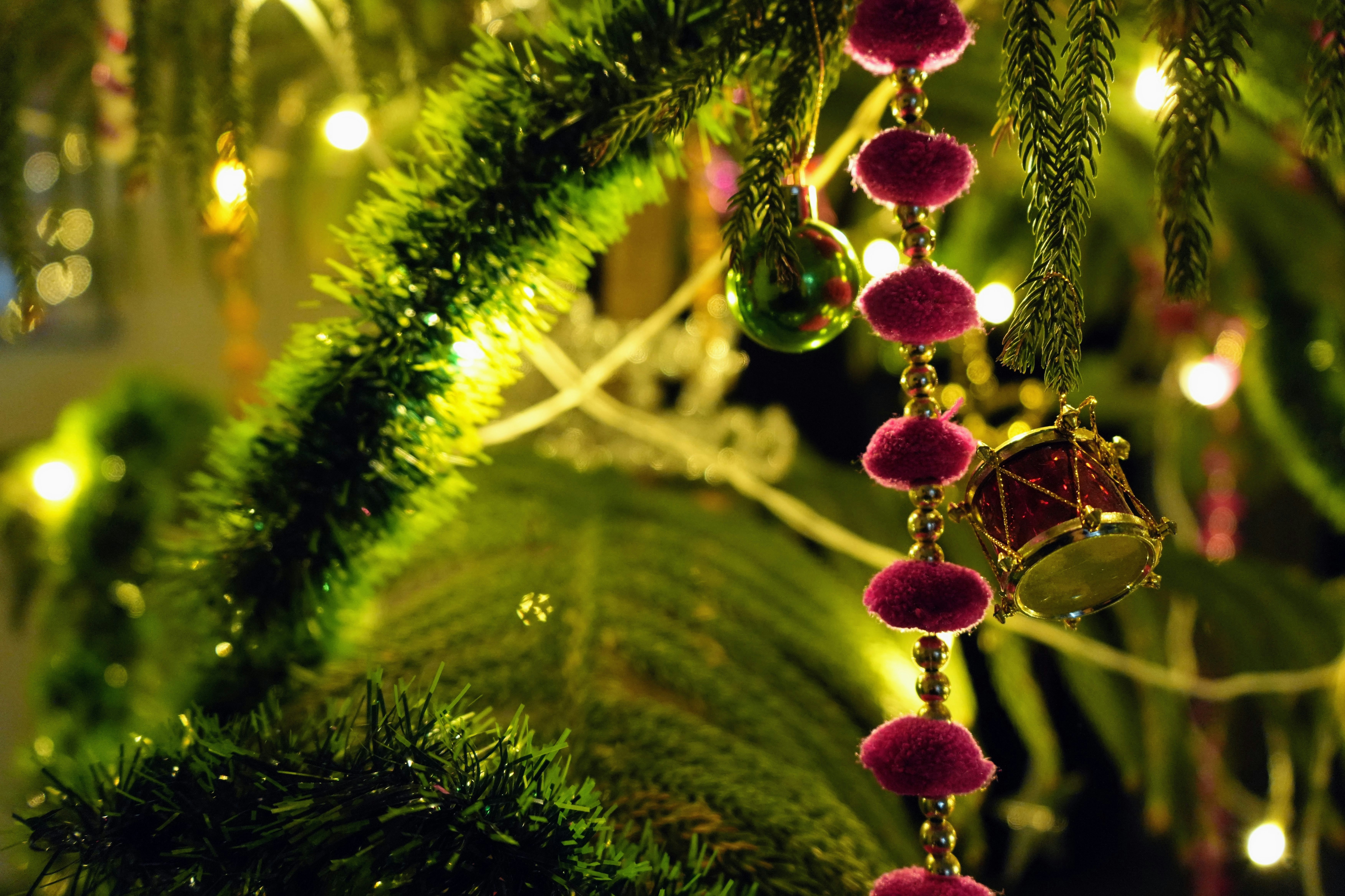 Velvet Beads Under Warm Lights: A Christmas Tree Close-Up