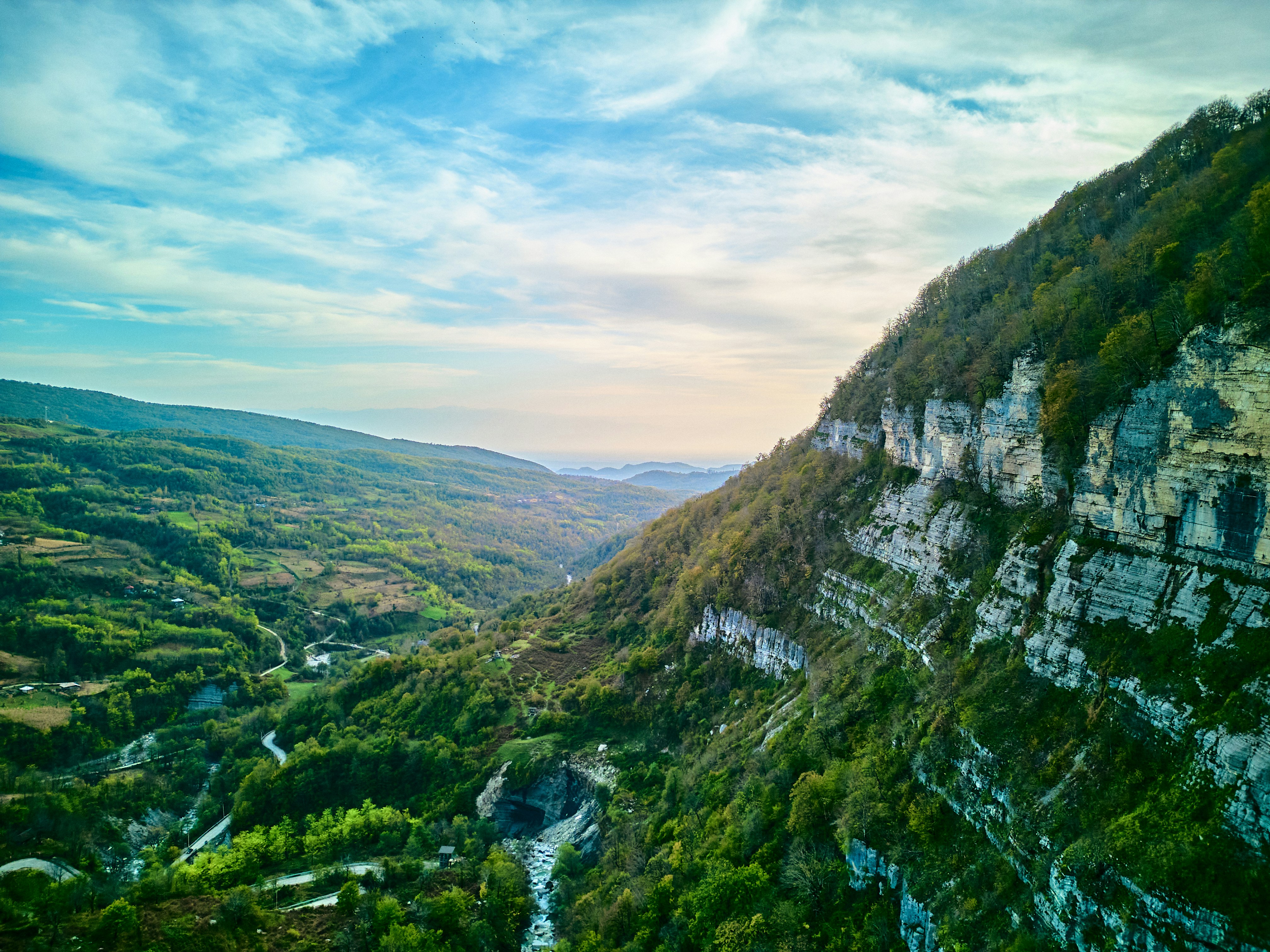 A scenic view of a valley with a river running through it photo – Free ...
