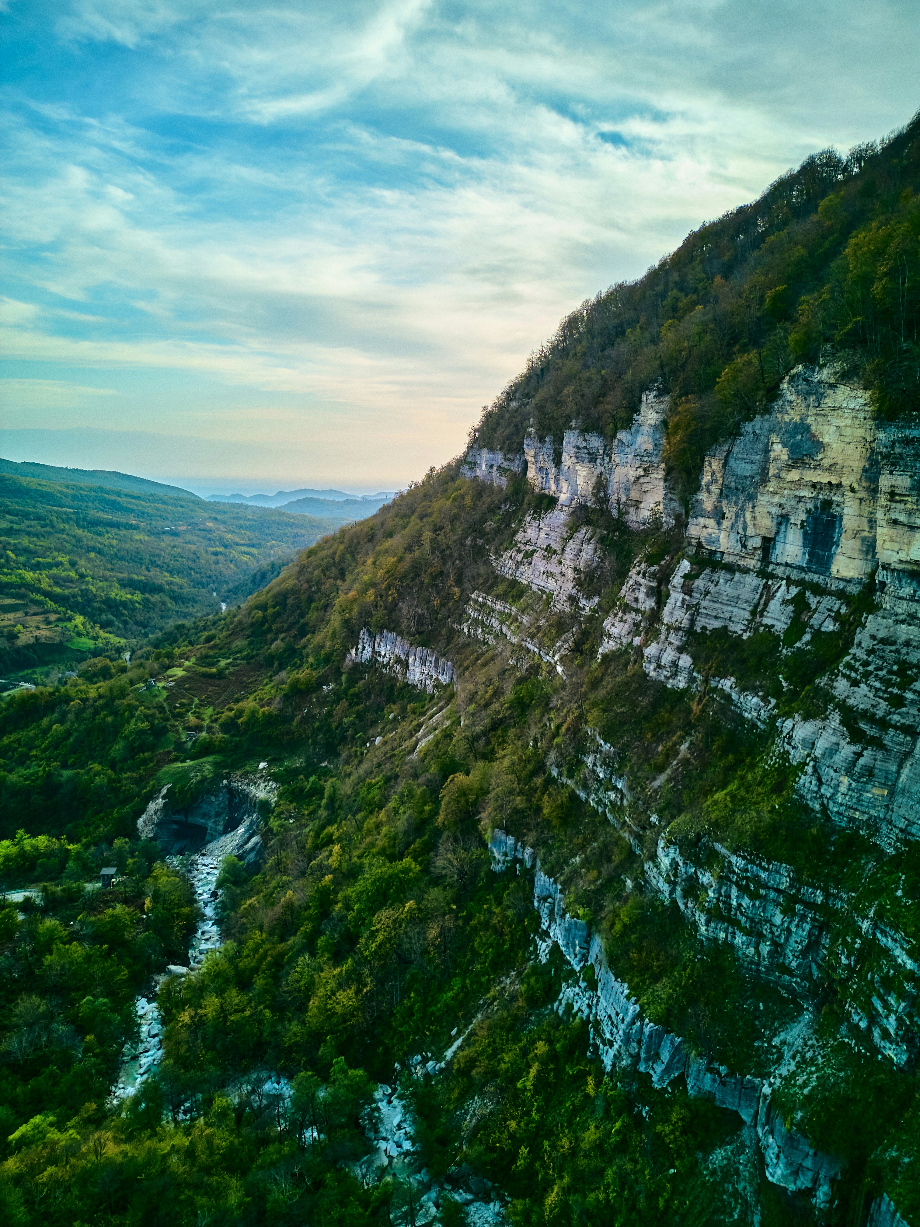 Ridge Above the Green Valley: Aerial Portrait of Limestone Cliffs