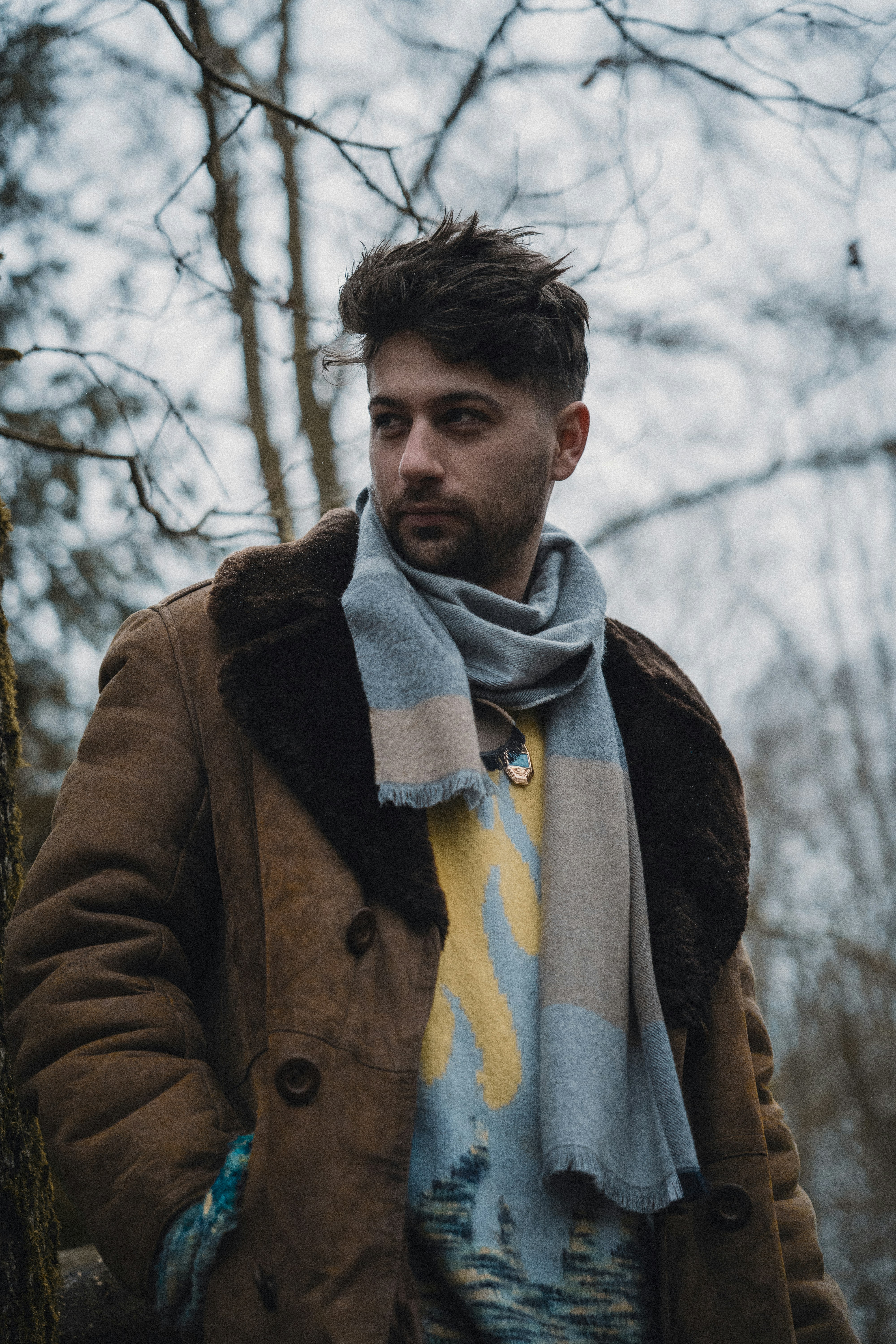 Winter Gaze: Portrait of Warmth Amid Bare Trees