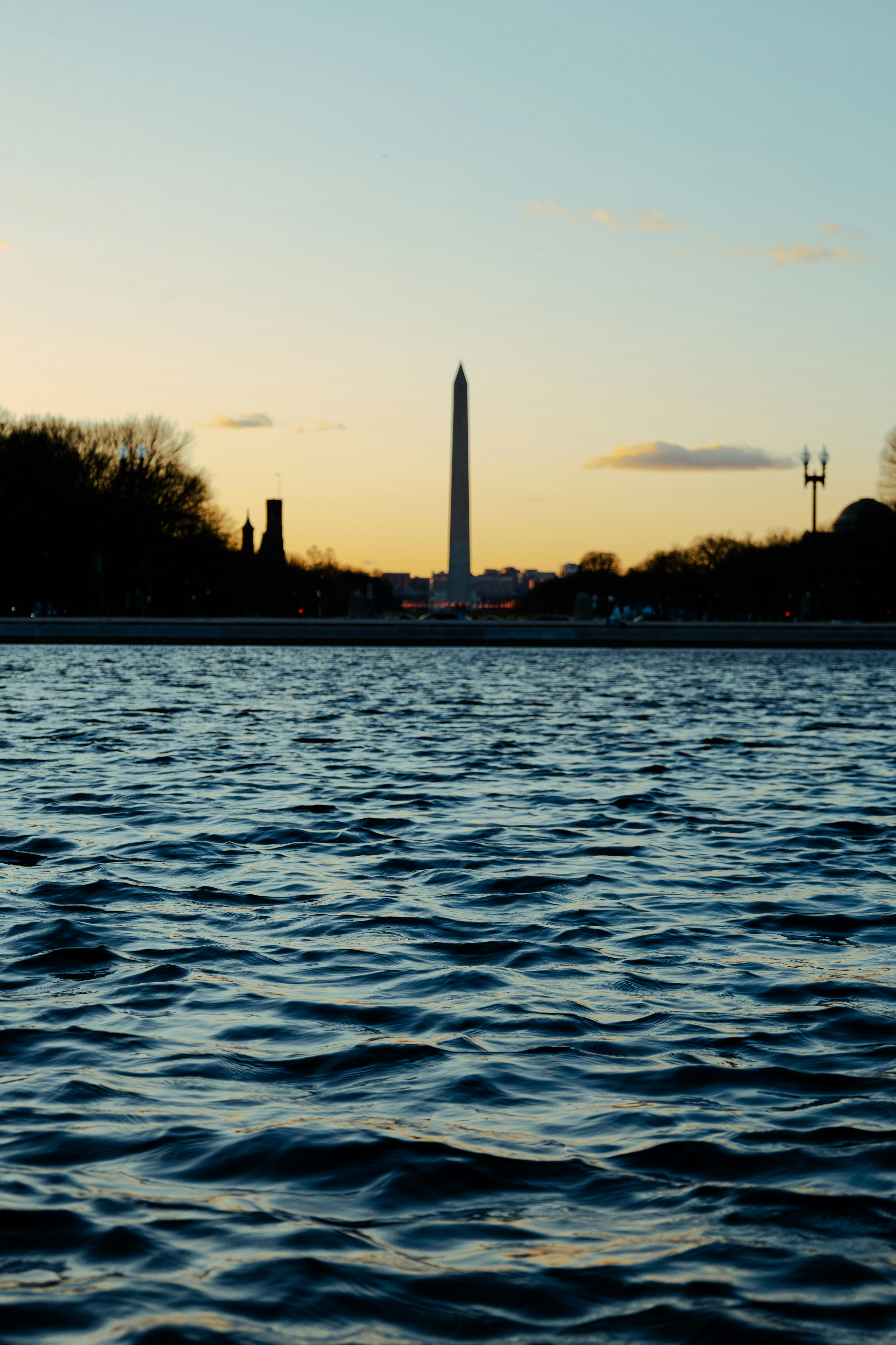 Dusk Sentinel: Washington Monument Silhouette Across the Potomac