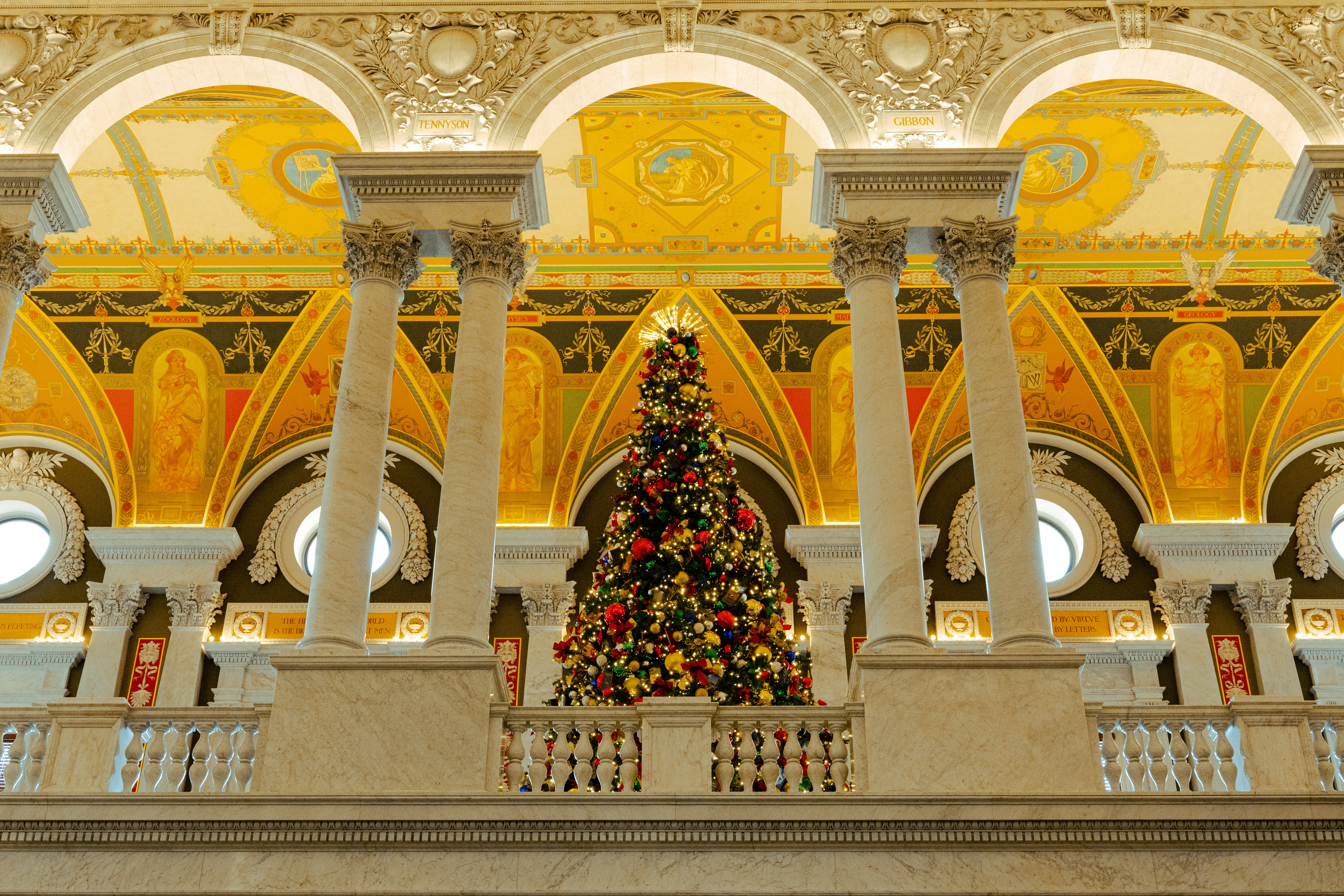 A large christmas tree in the middle of a building photo – Free Library ...
