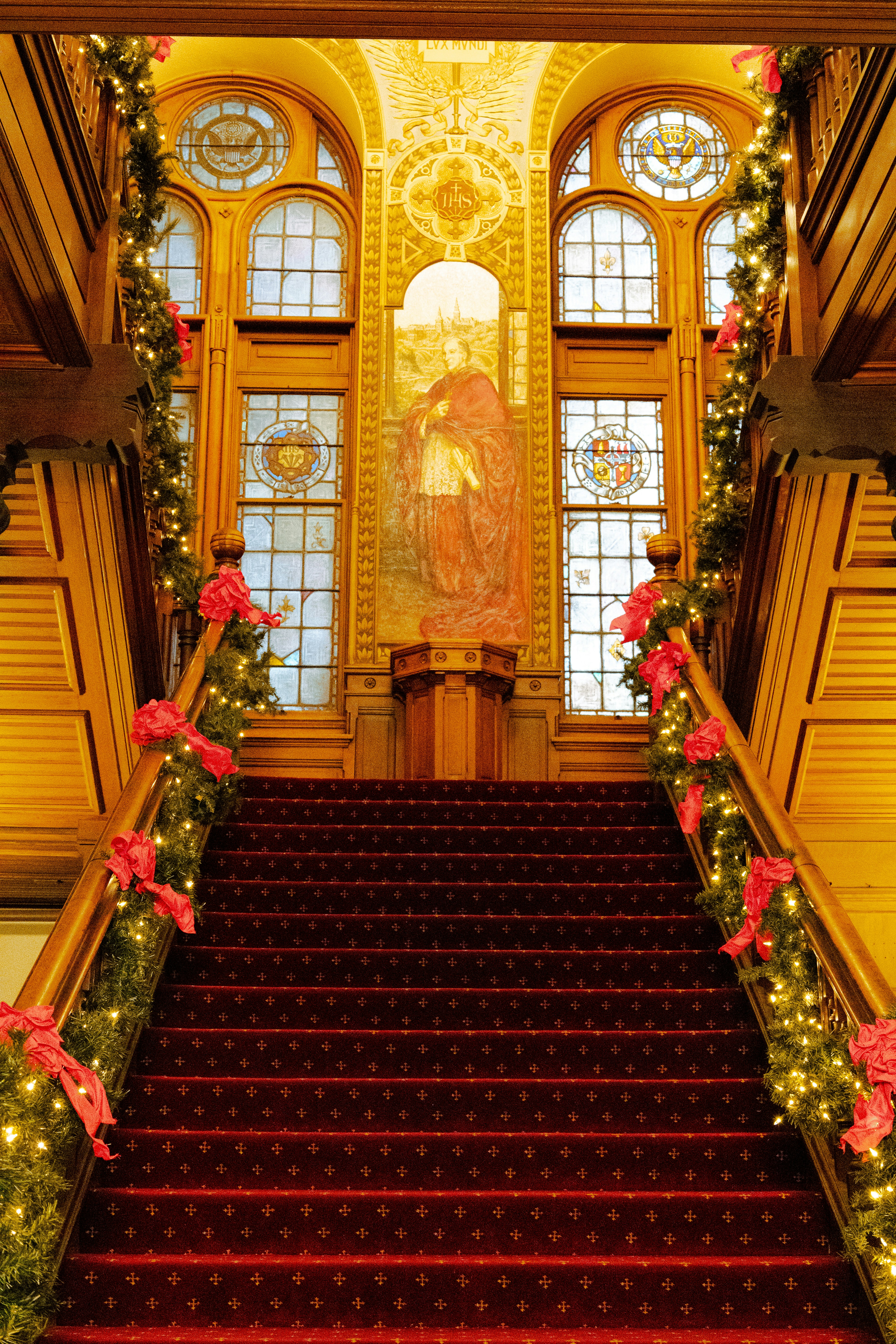 Christmas Glow on an Ornate Staircase: Central Portrait Framed by Stained Glass