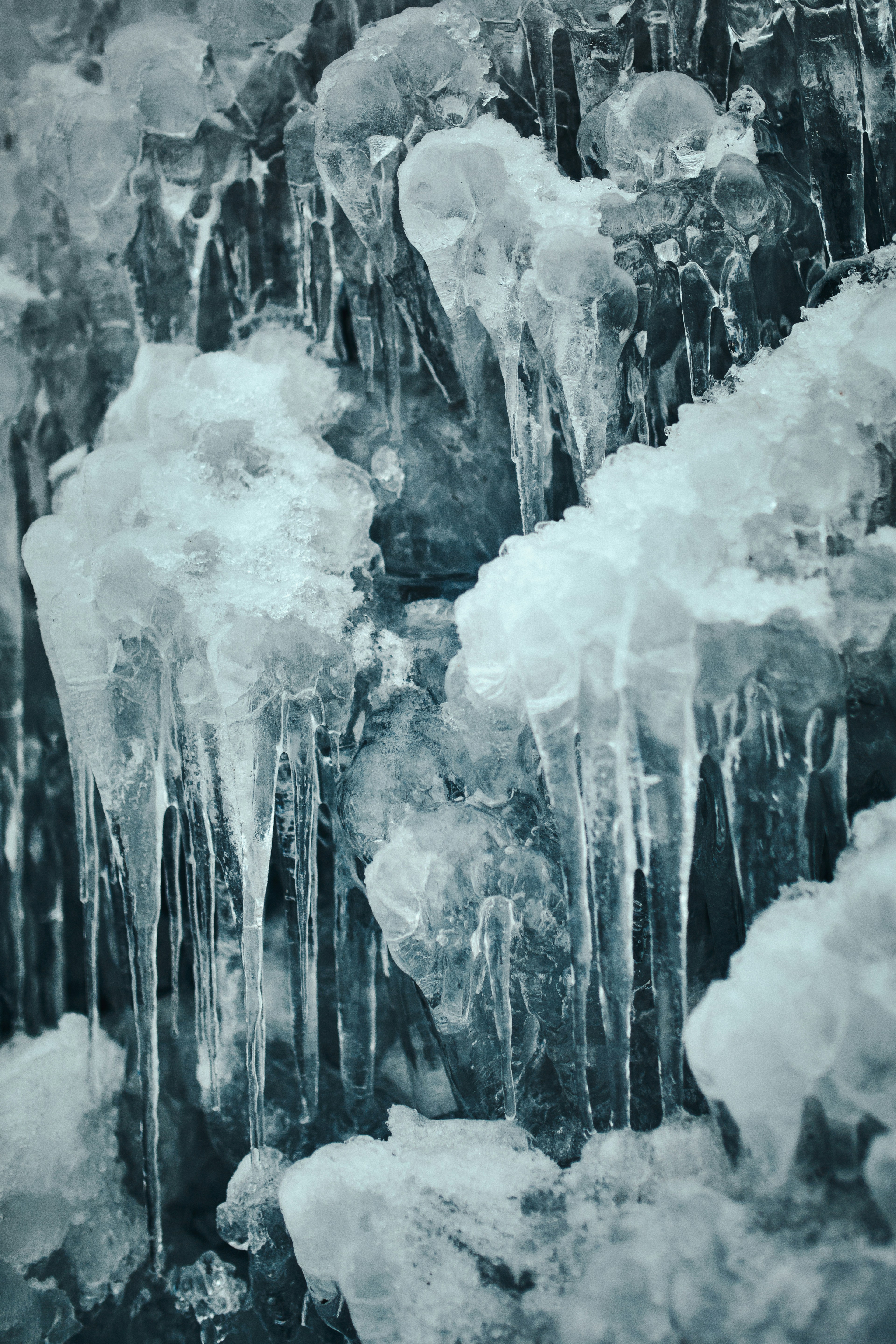 A group of ice formations with icicles on them photo – Free Image on ...