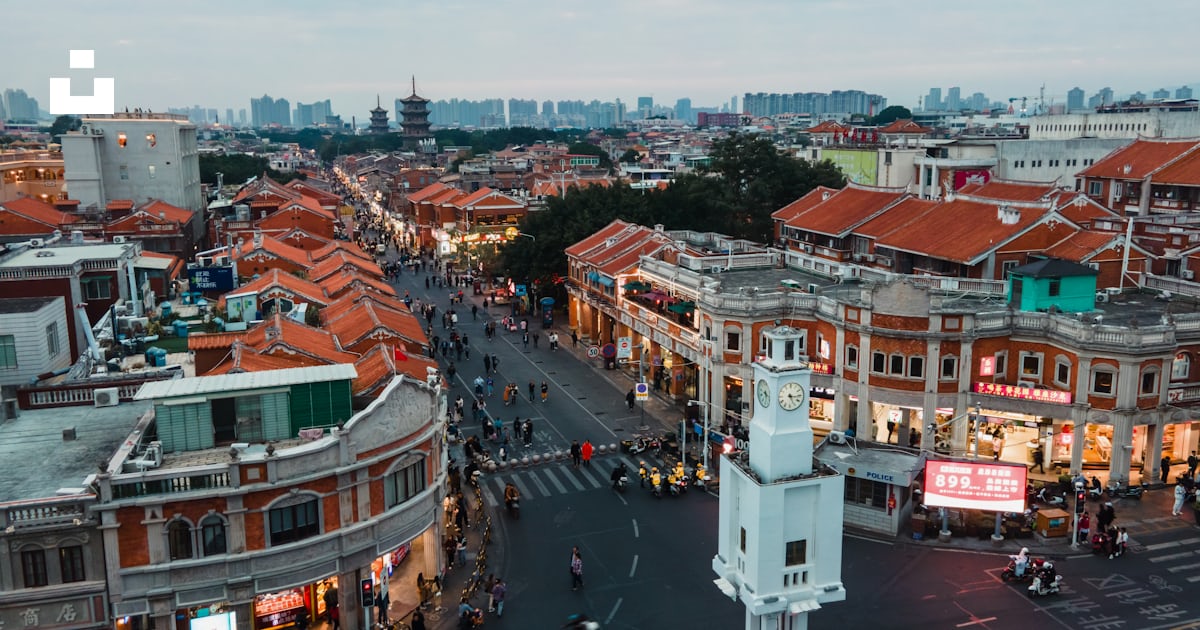 An Aerial View Of A City With A Clock Tower Photo Free Quanzhou Image
