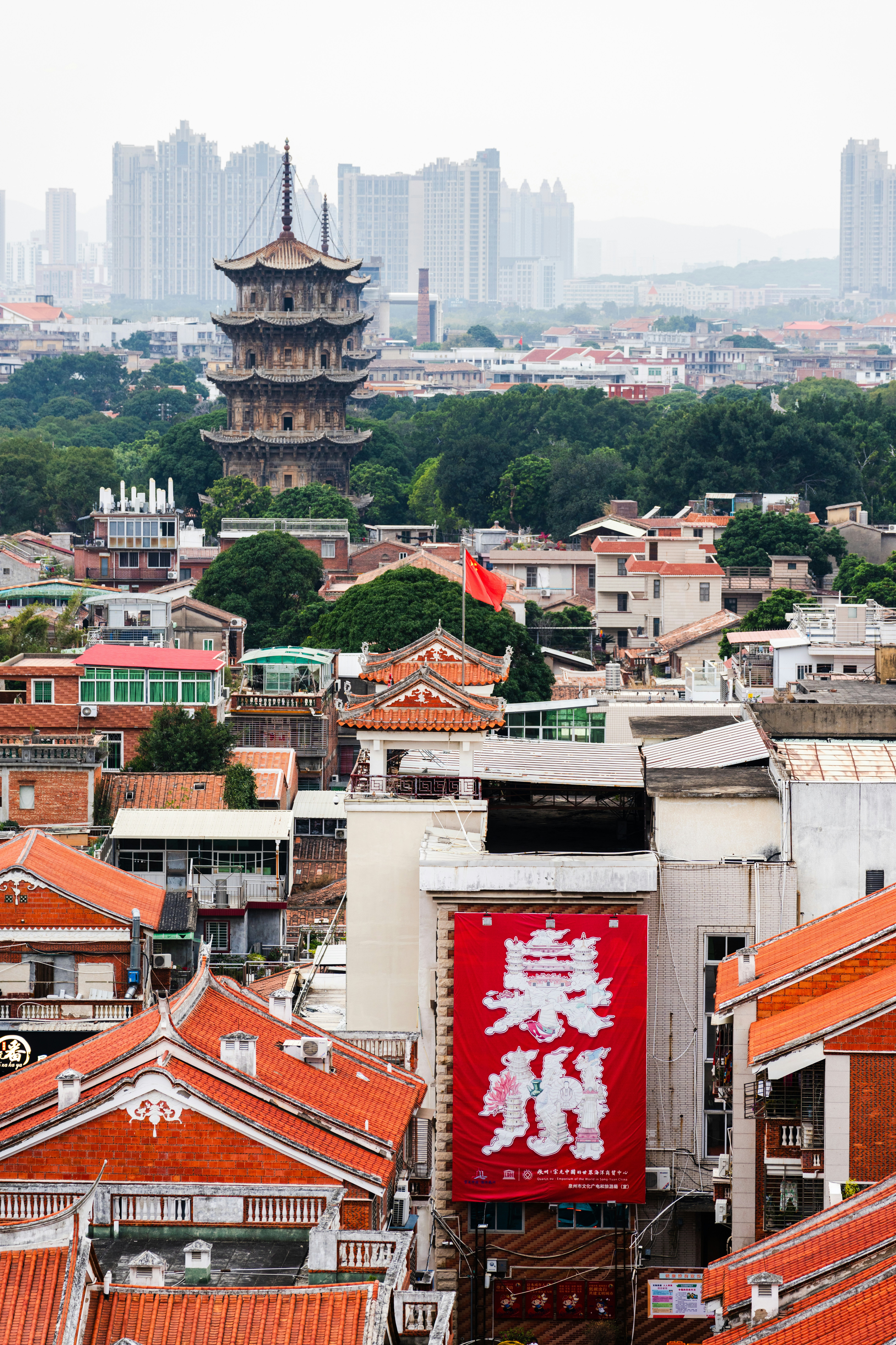 Pagoda Overlook: Red Roofs Framing a Distant Glass Skyline