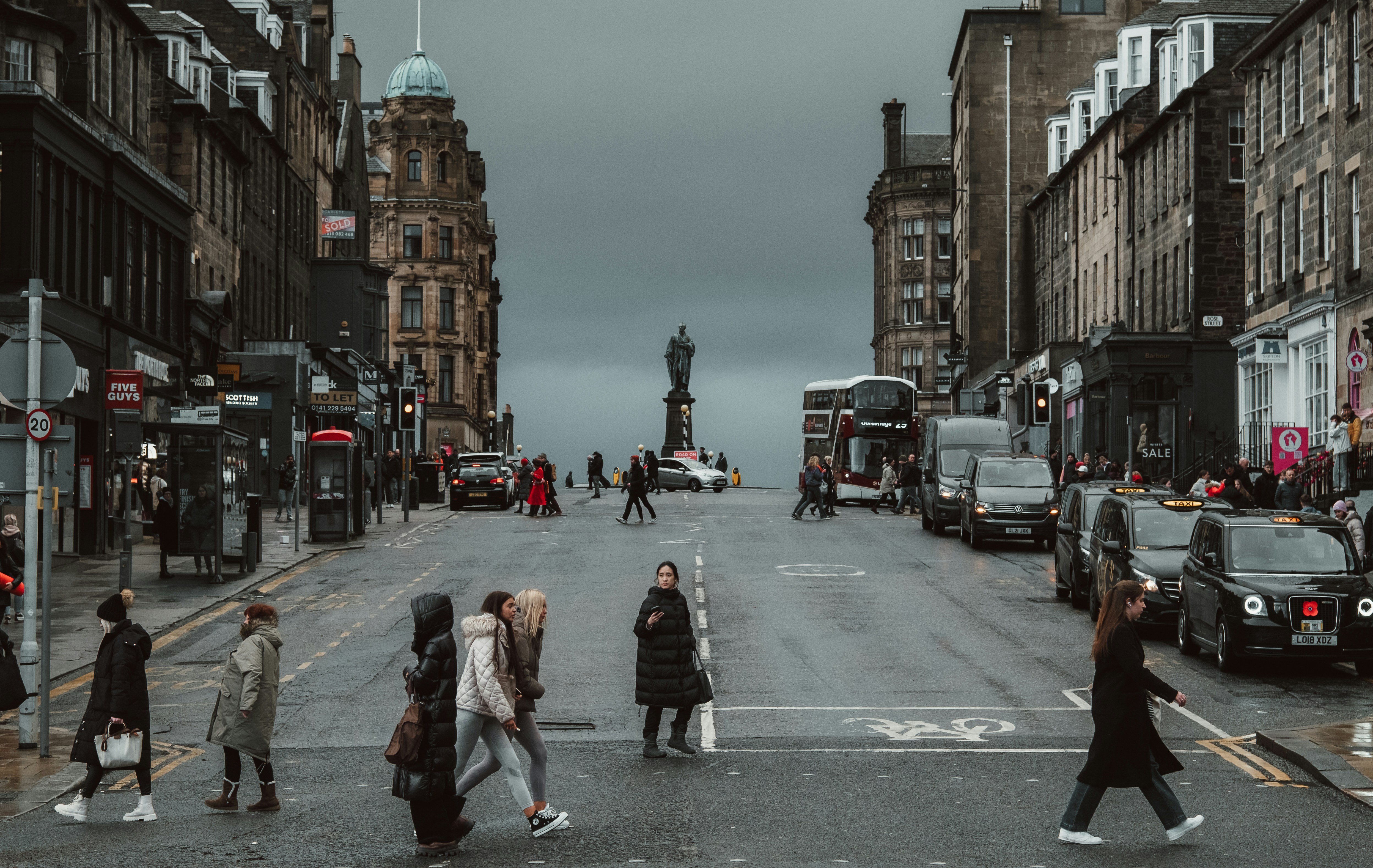 A group of people crossing a street in a city photo – Free Bus Image on ...