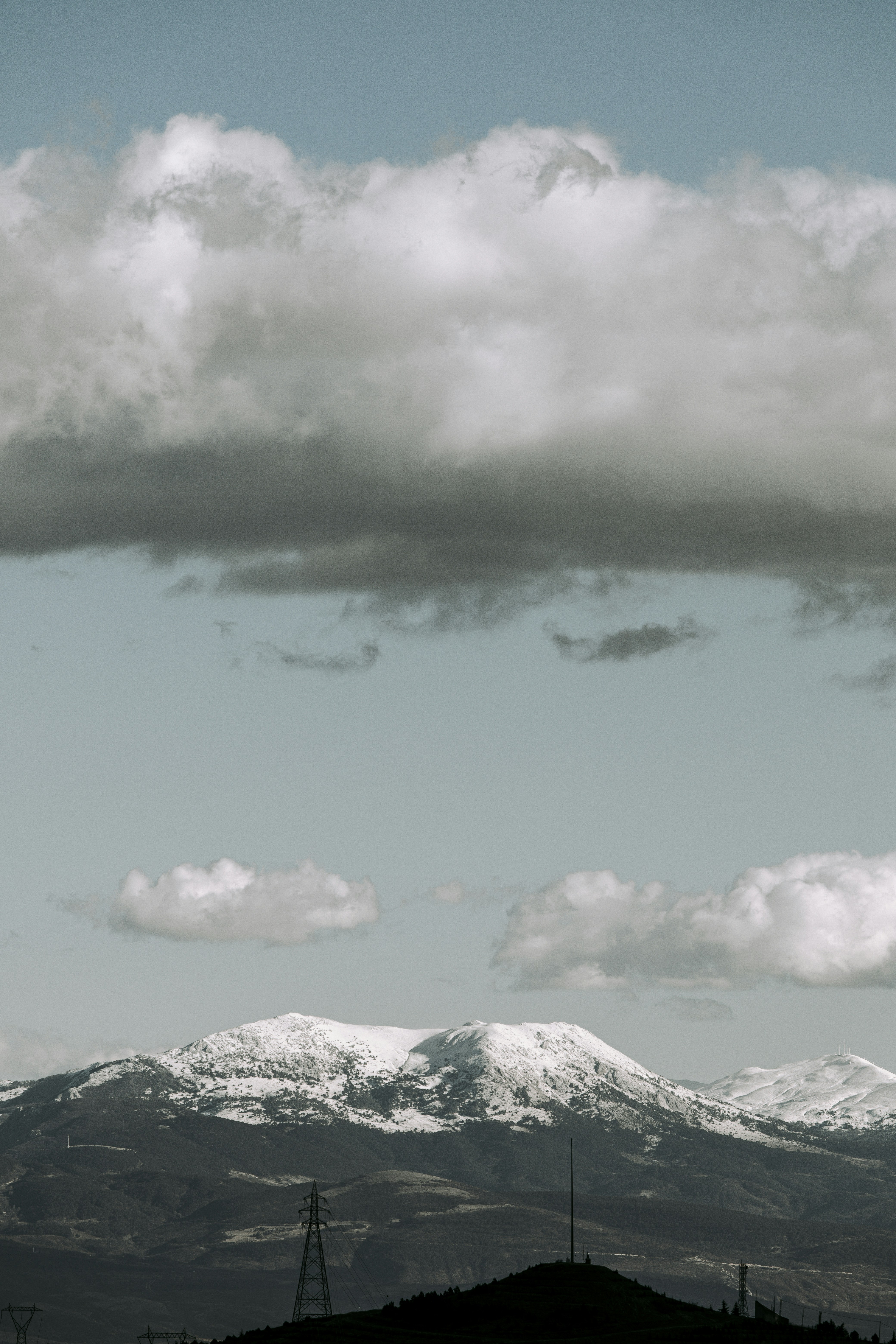 A view of a mountain range with clouds in the sky photo – Free Snow mountain sky clouds Image on ...