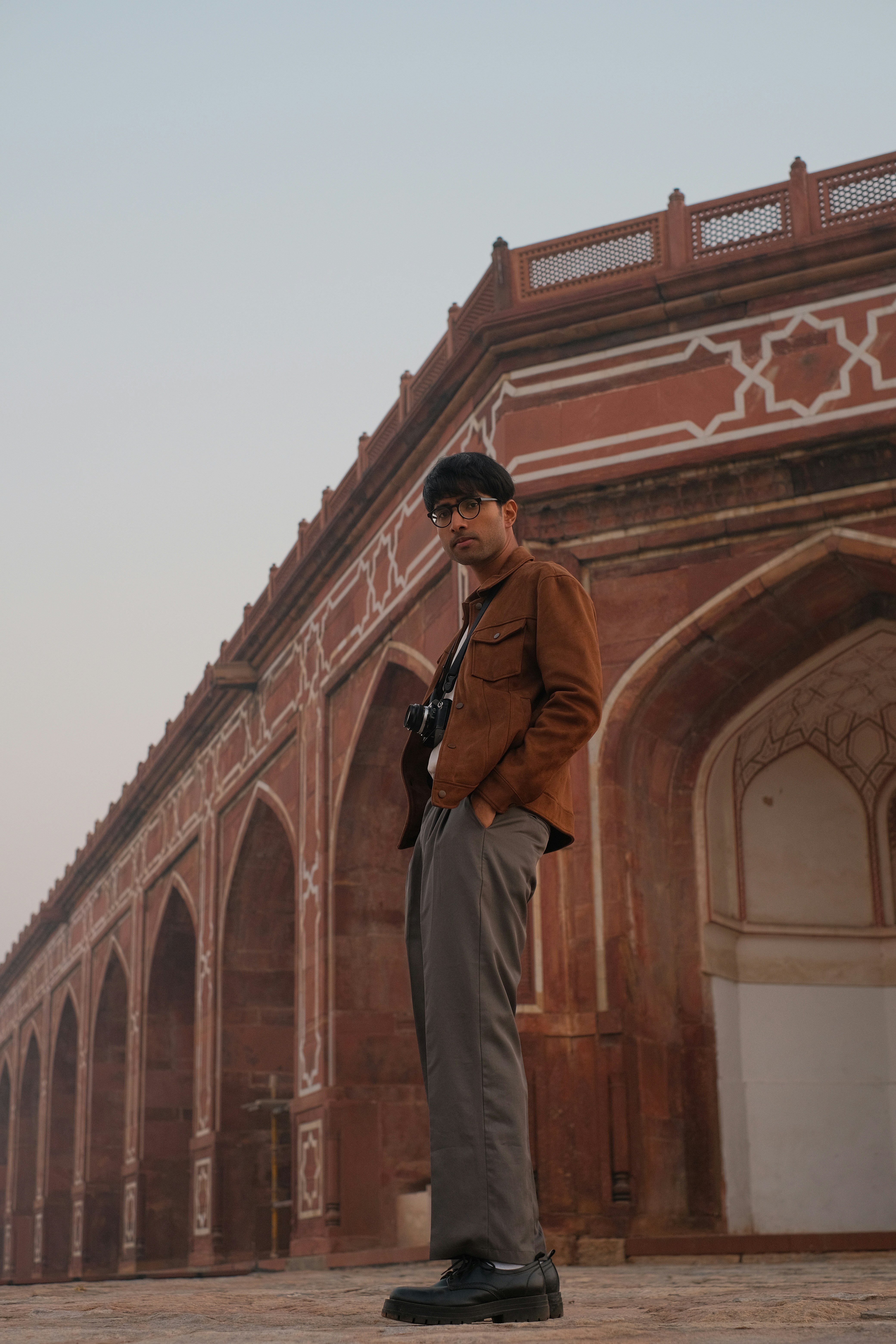 Between Arches and Focus: A Quiet Portrait Under Red Sandstone