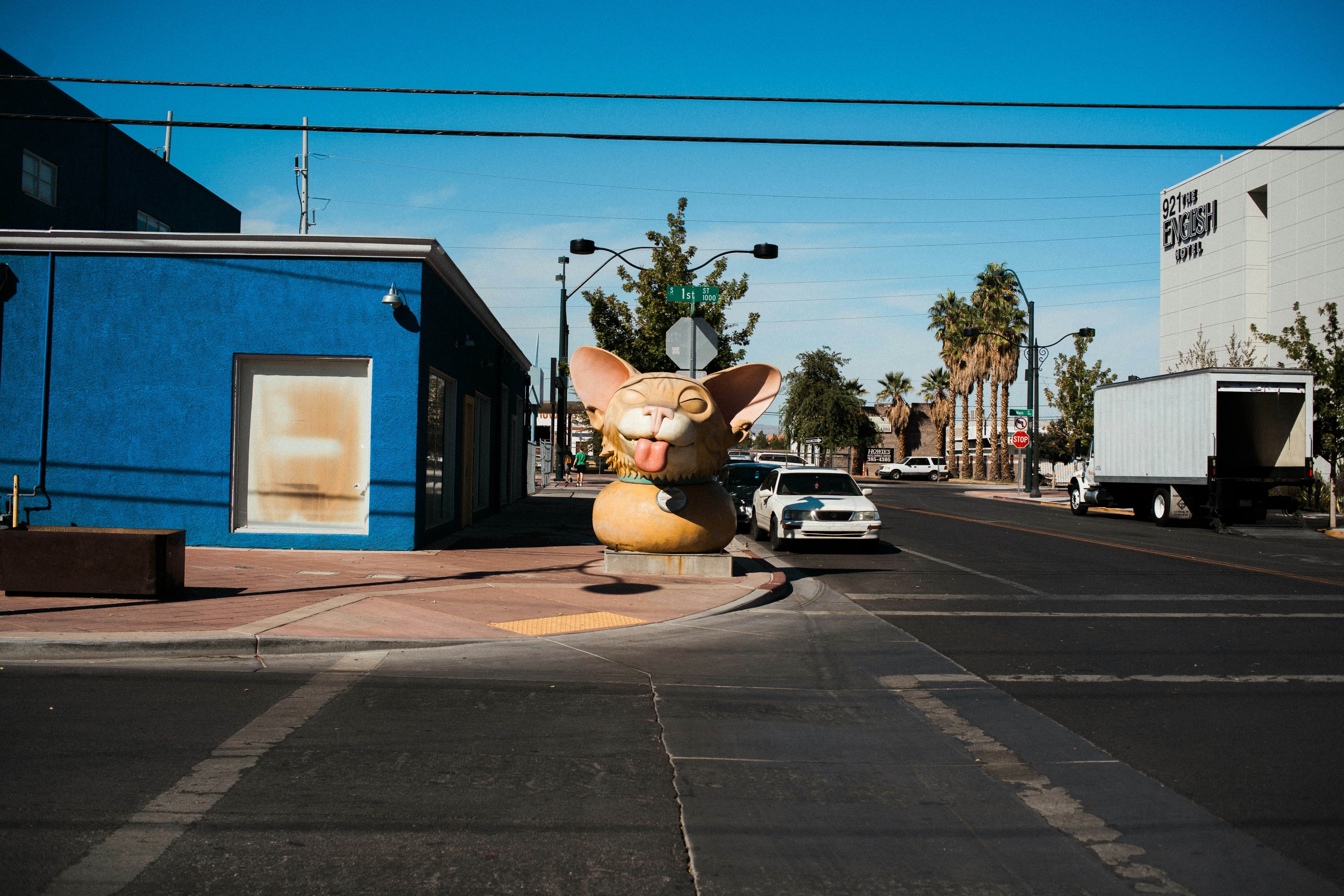 Giant Plush Statue at a Sunlit Street Corner