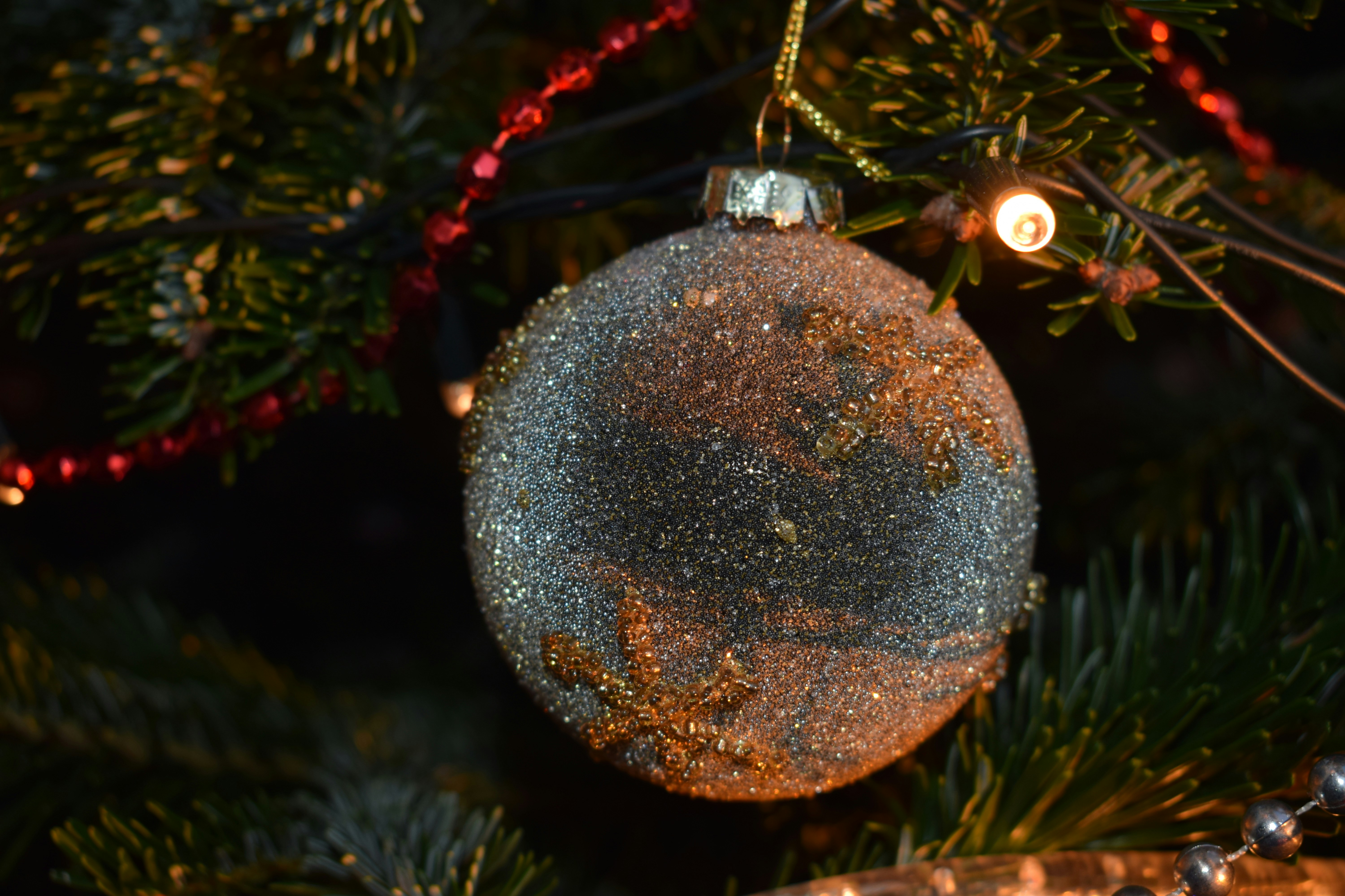 Moonlit Glitter on a Pine Bauble in Holiday Glow