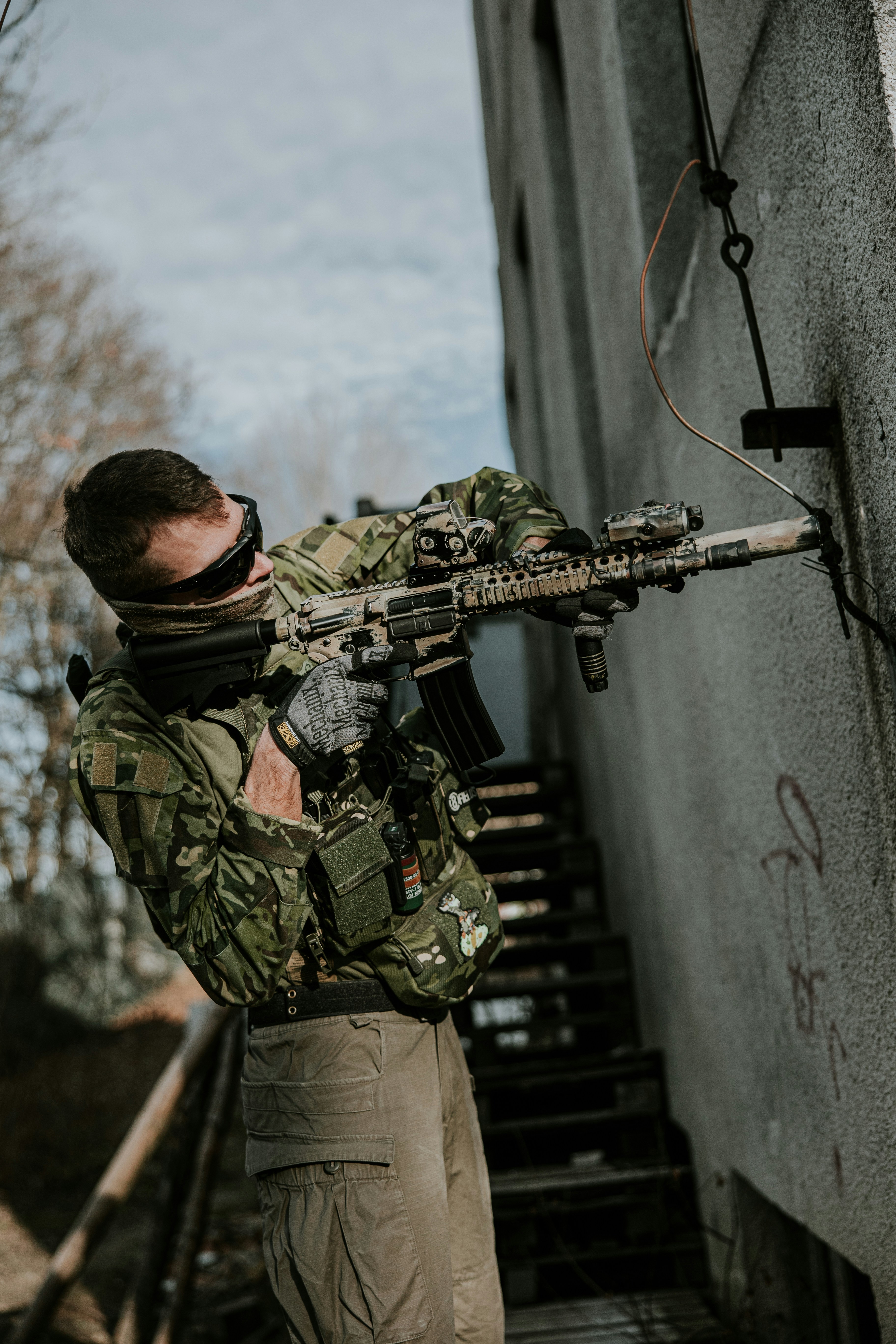 Stairwell Standoff: A Camouflage Marksman Anchored to the Concrete