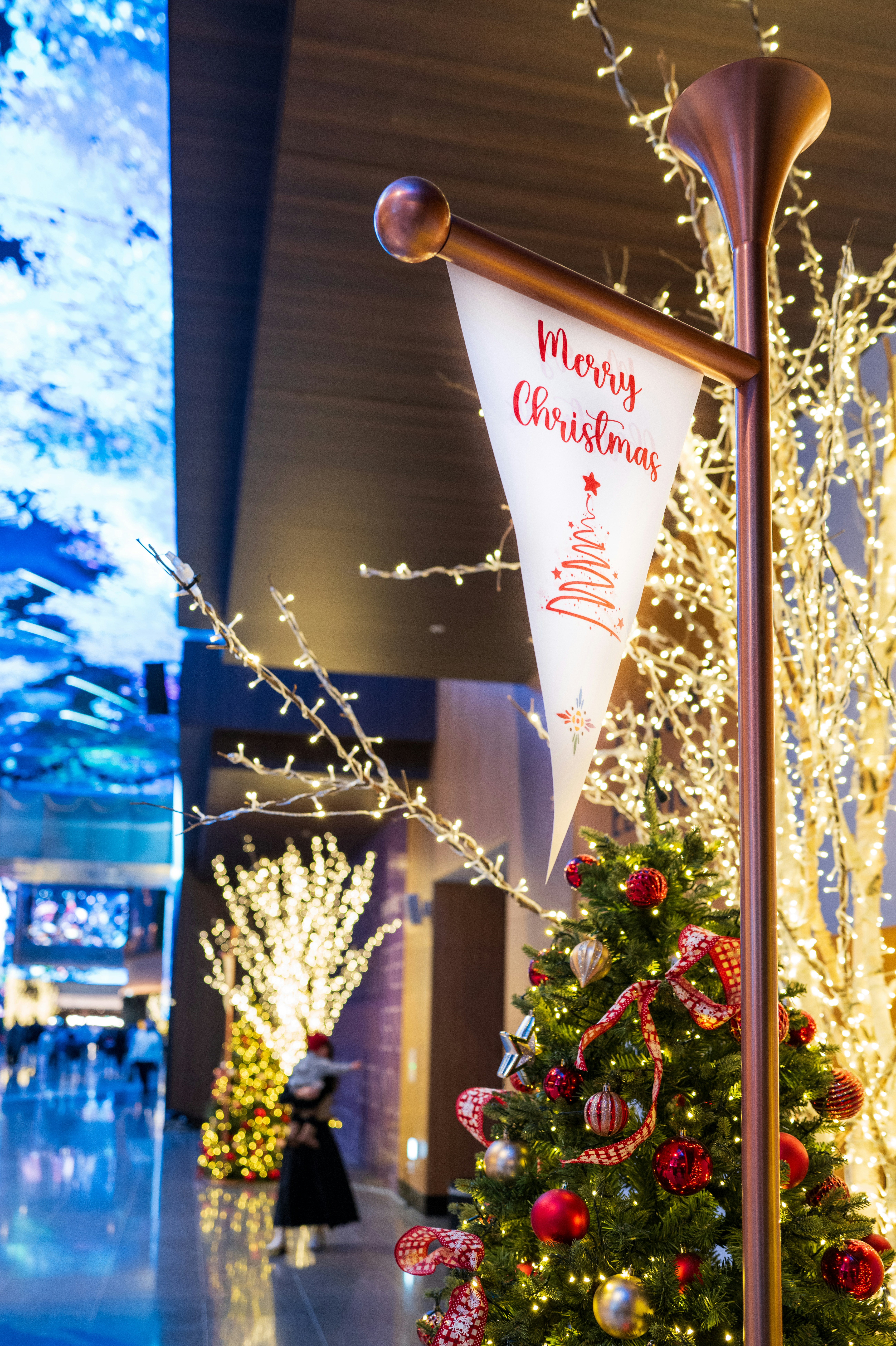 a decorated christmas tree in a lobby