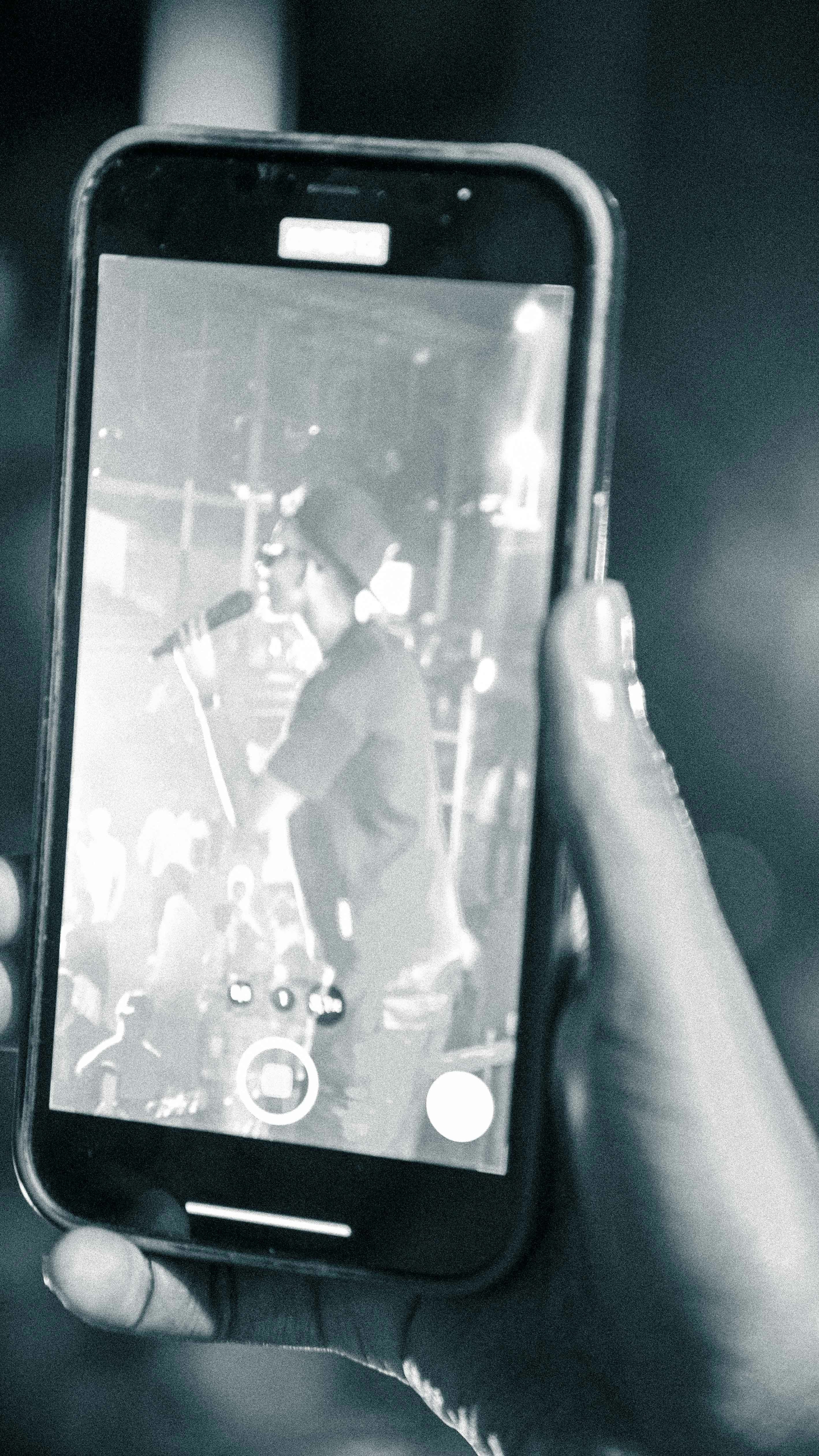 a person holding a cell phone with a picture on it