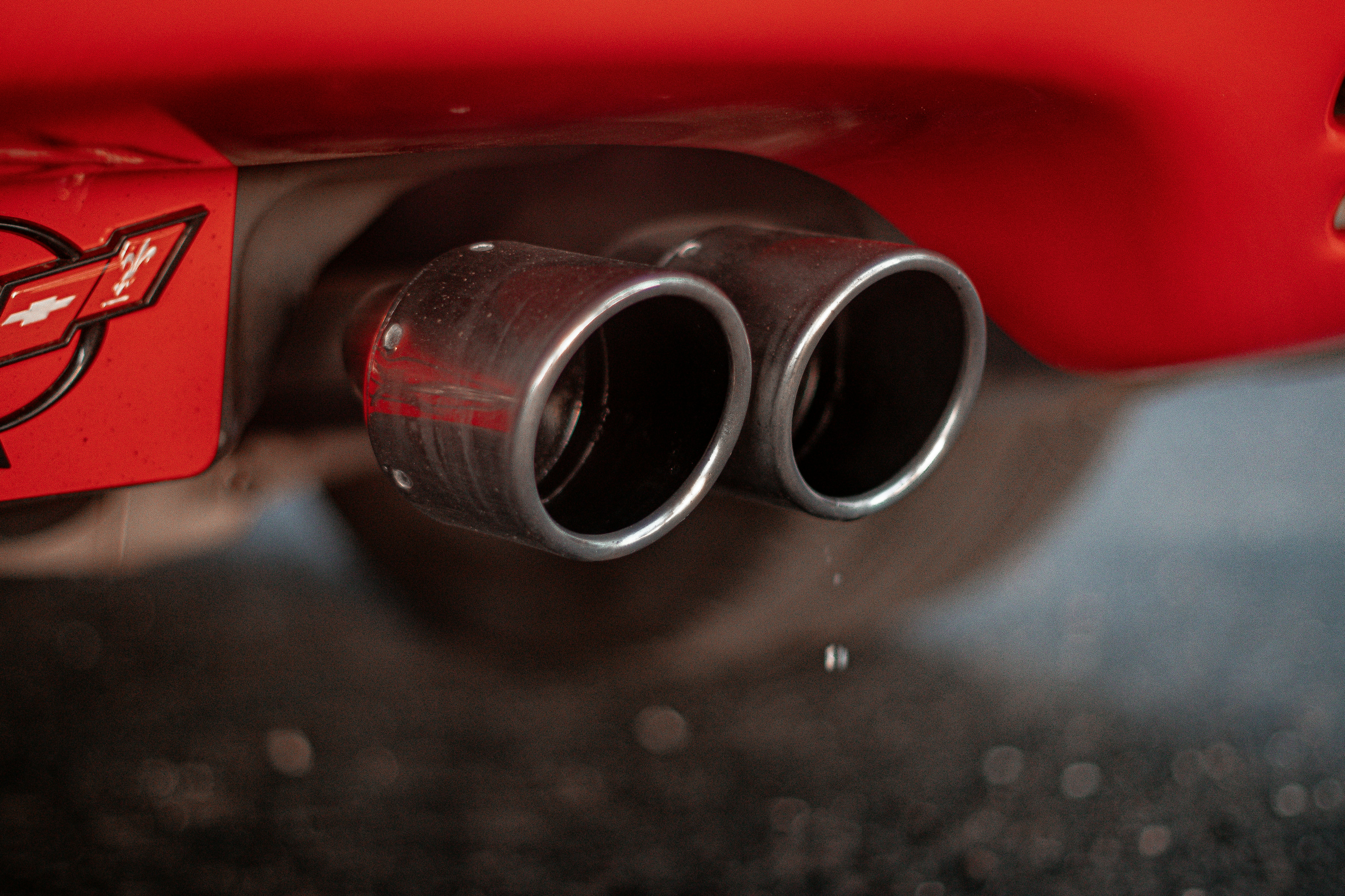 A close up of the exhaust pipes on a red sports car photo – Free Tape ...