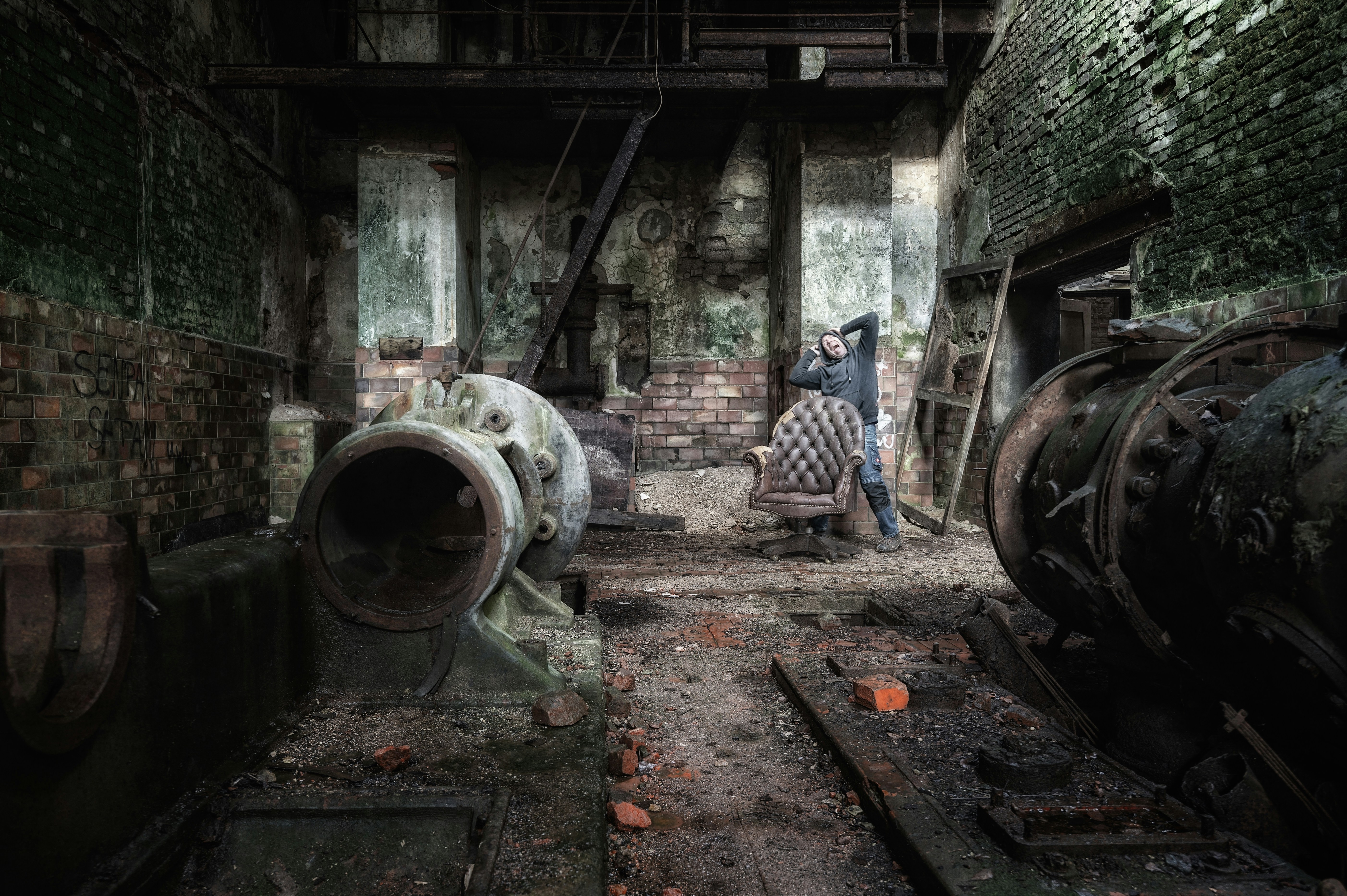 Rust-Worn Recline: A solitary chair anchors a derelict mill