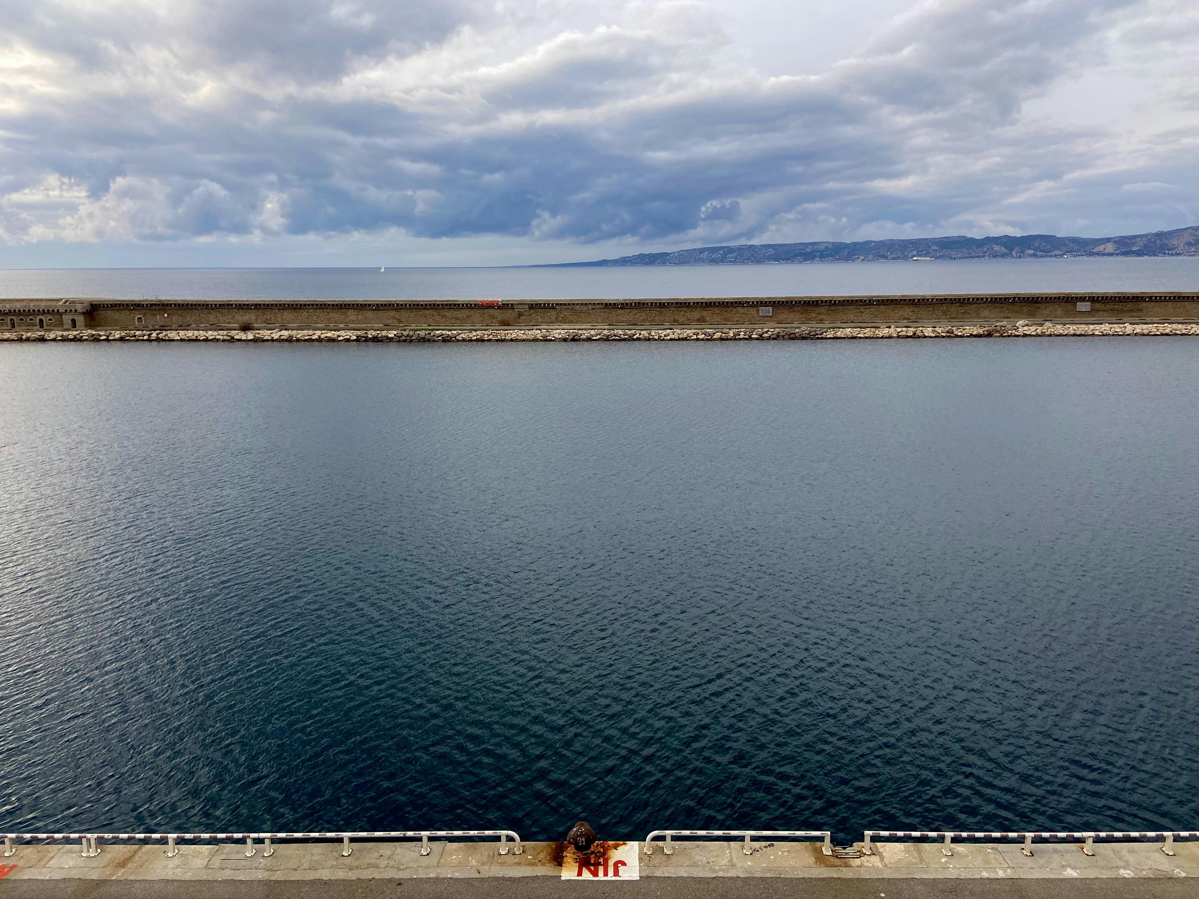Tranquil Waters Against a Stormy Sky