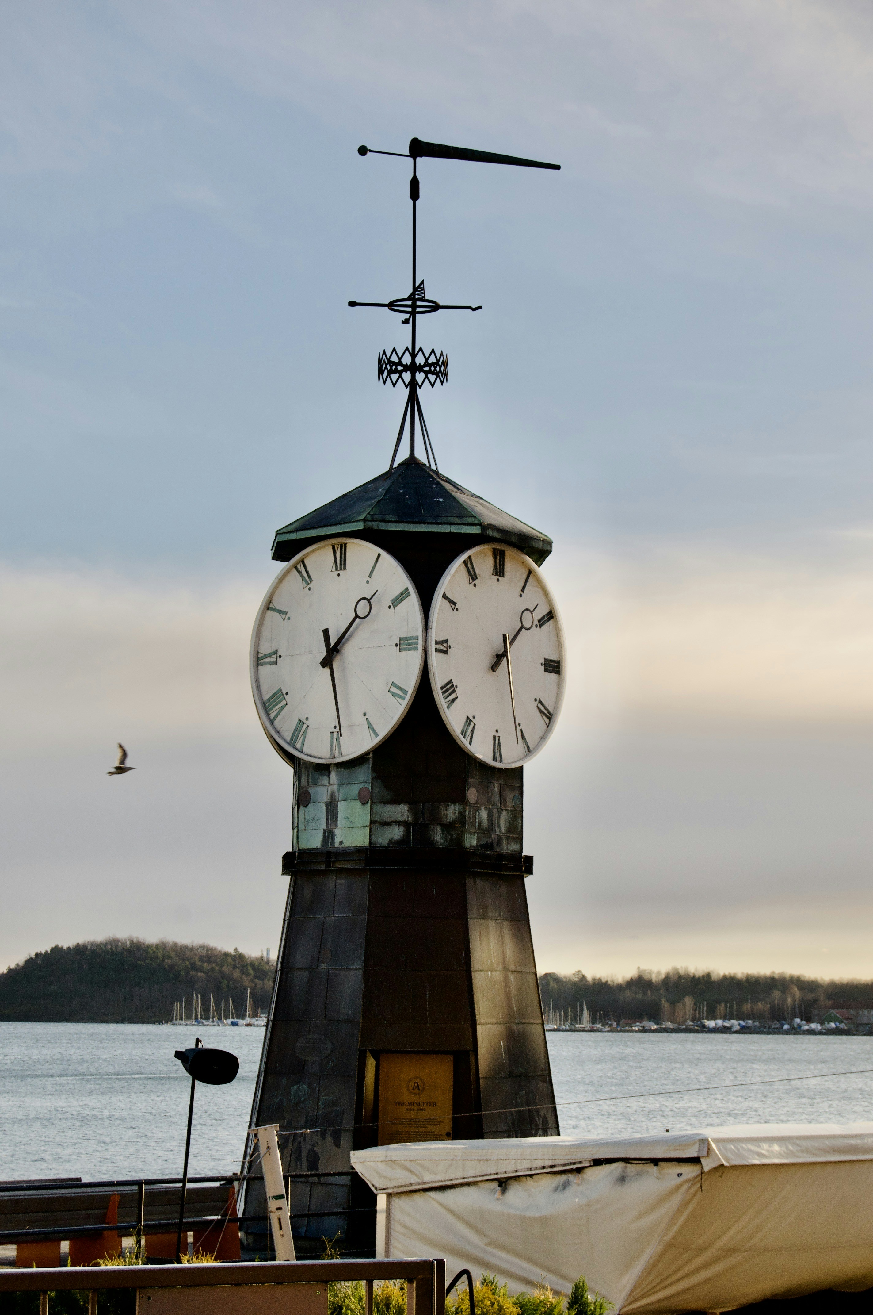 Twin Clock Faces Crown a Seaside Clocktower at Dusk