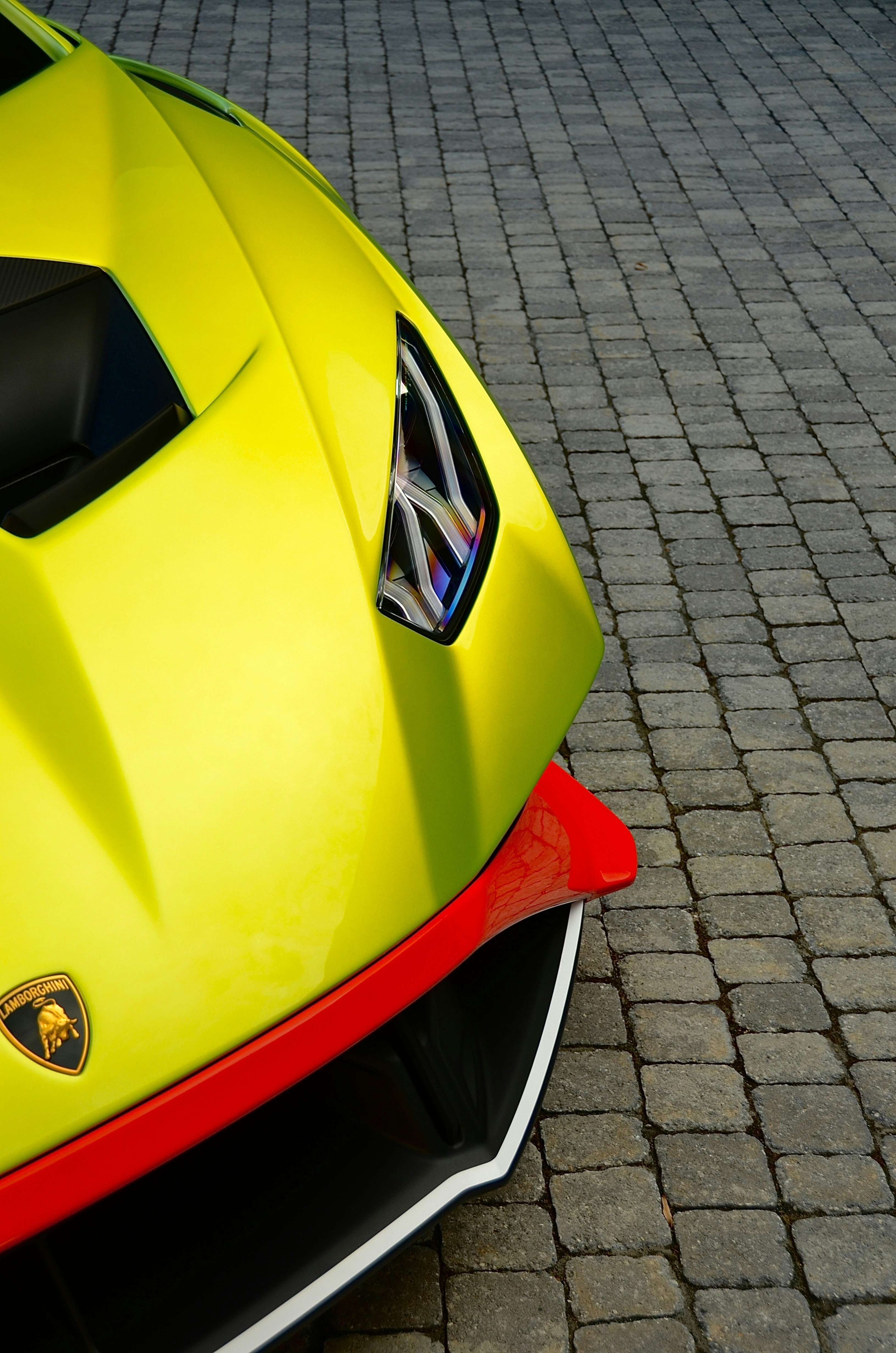 Neon Lime Front: Precision Angles on a Cobblestone Runway