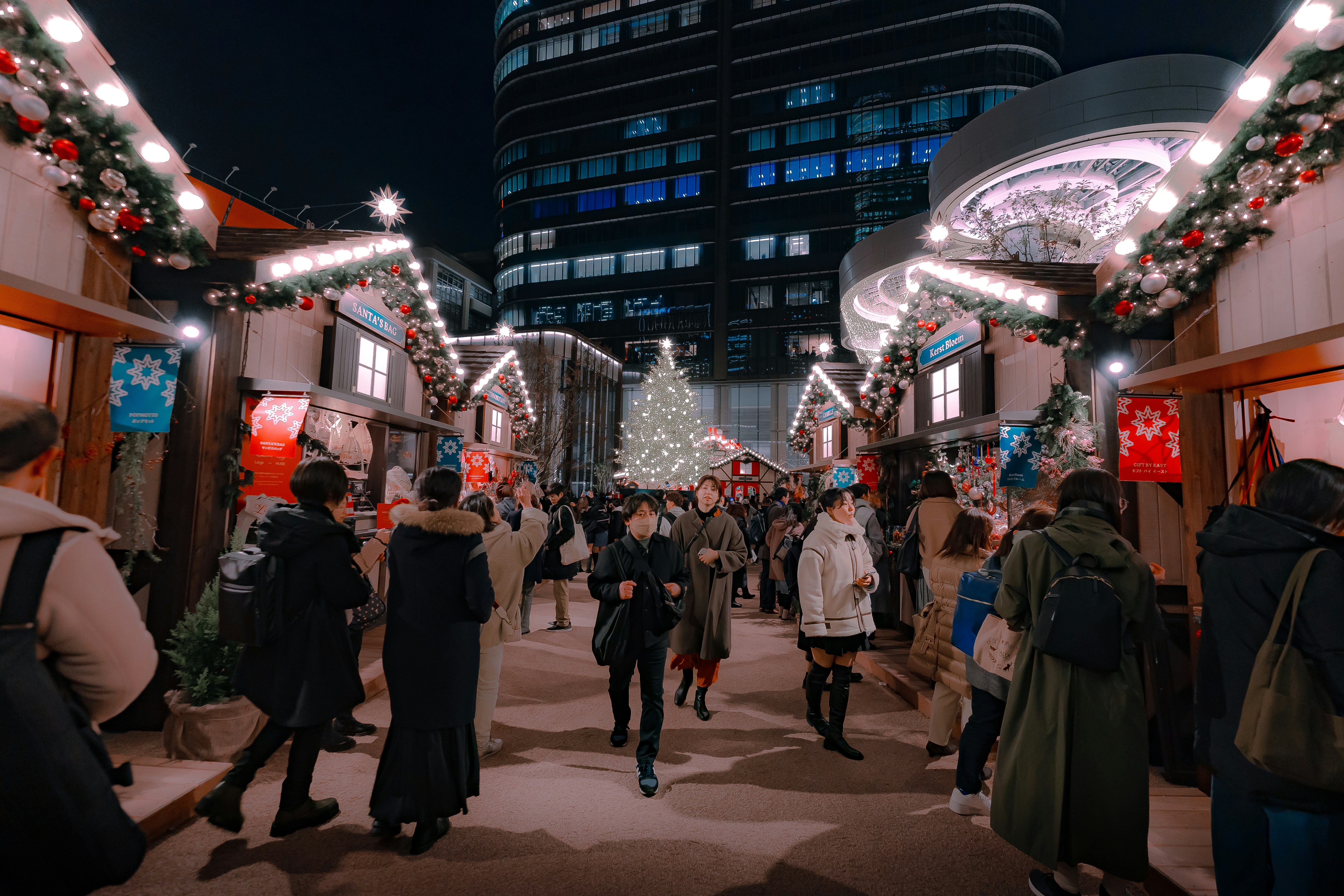 Midnight Market Luminescence: Christmas Lights Framing a City Street