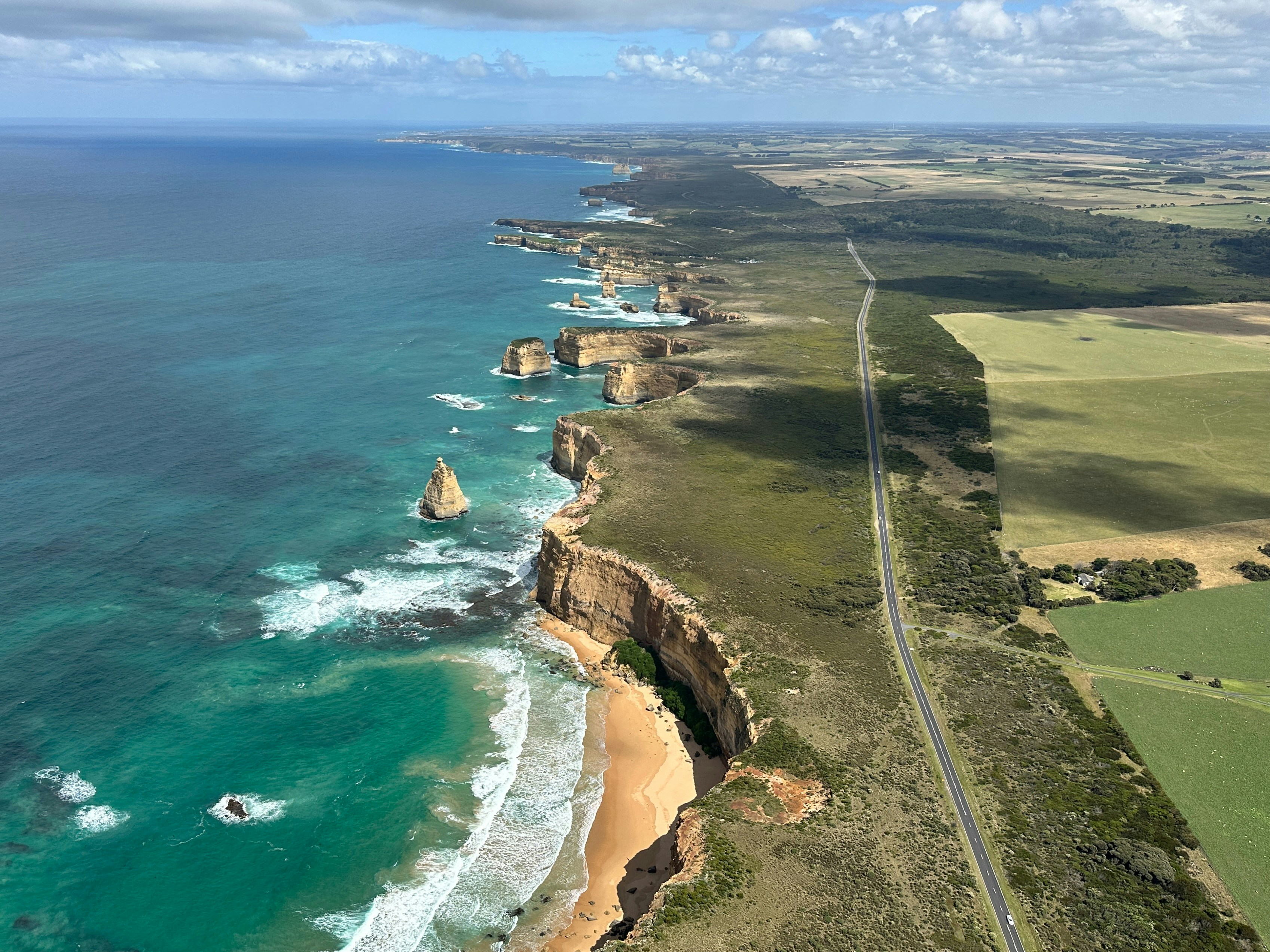 An aerial view of a highway near the ocean photo – Free Australia Image ...