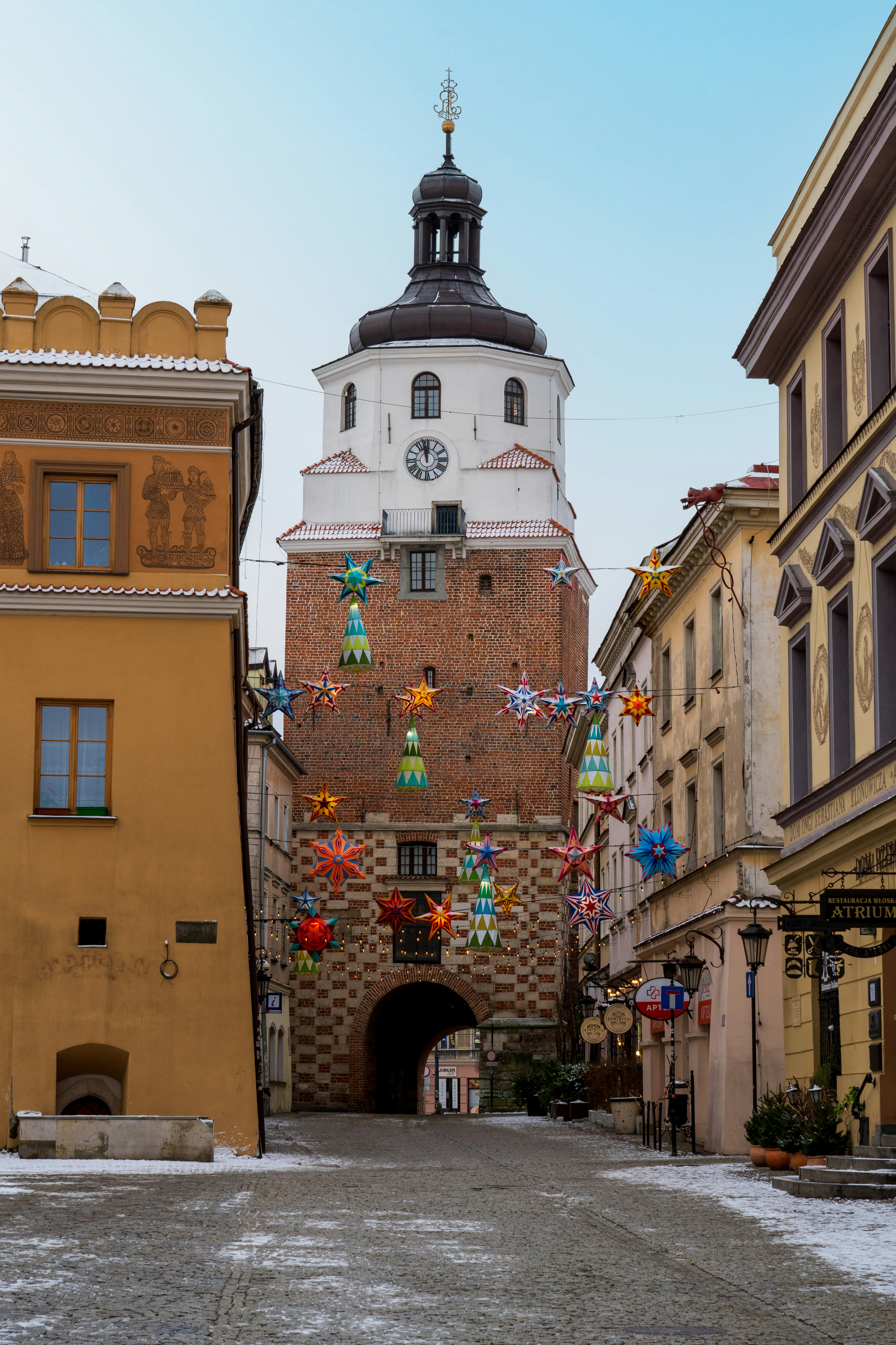 A clock tower towering over a city street photo – Free Winter Image on ...