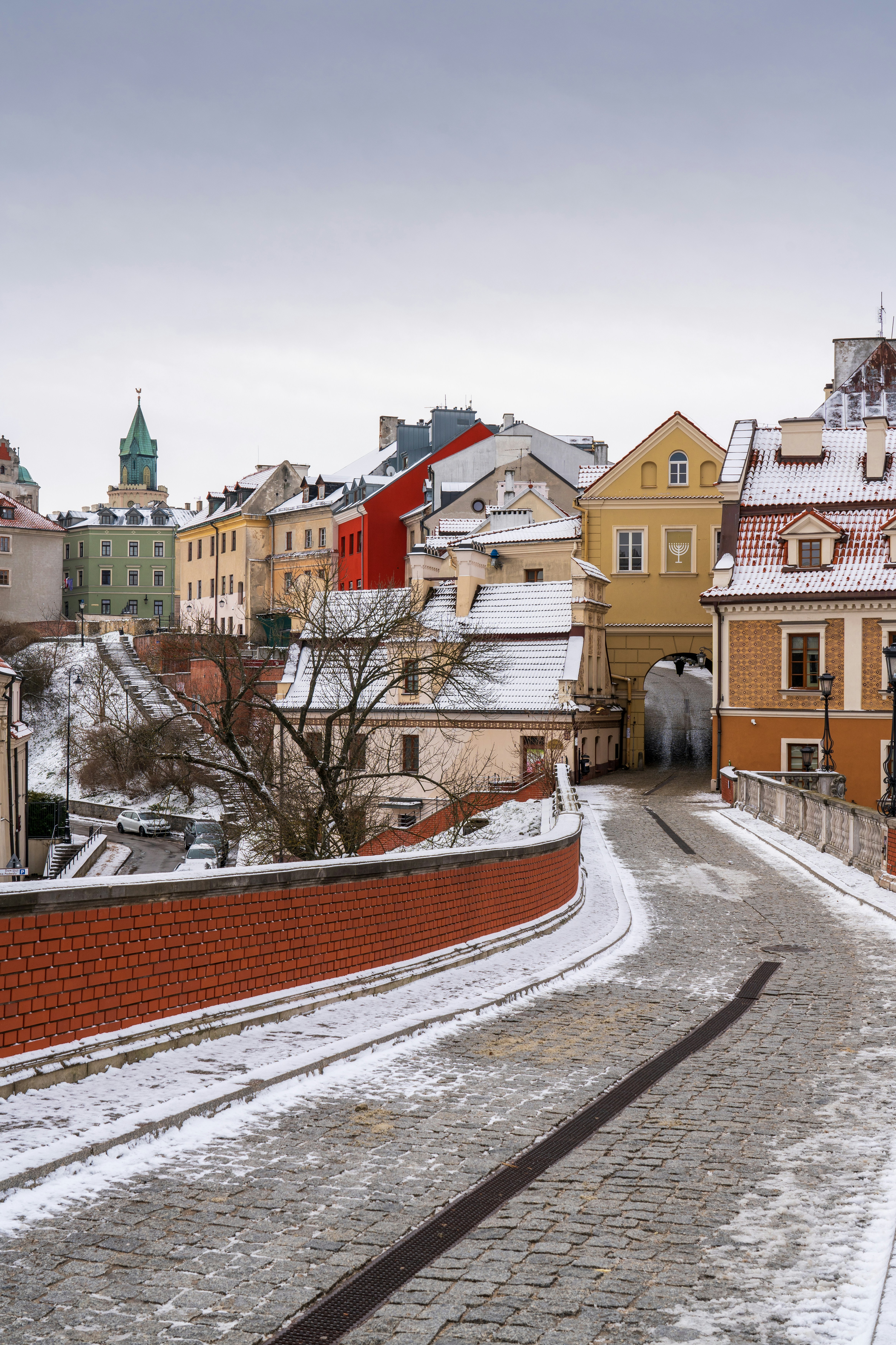 Snow-Lined Cobblestones: A Winding Palette of Pastel Townhouses