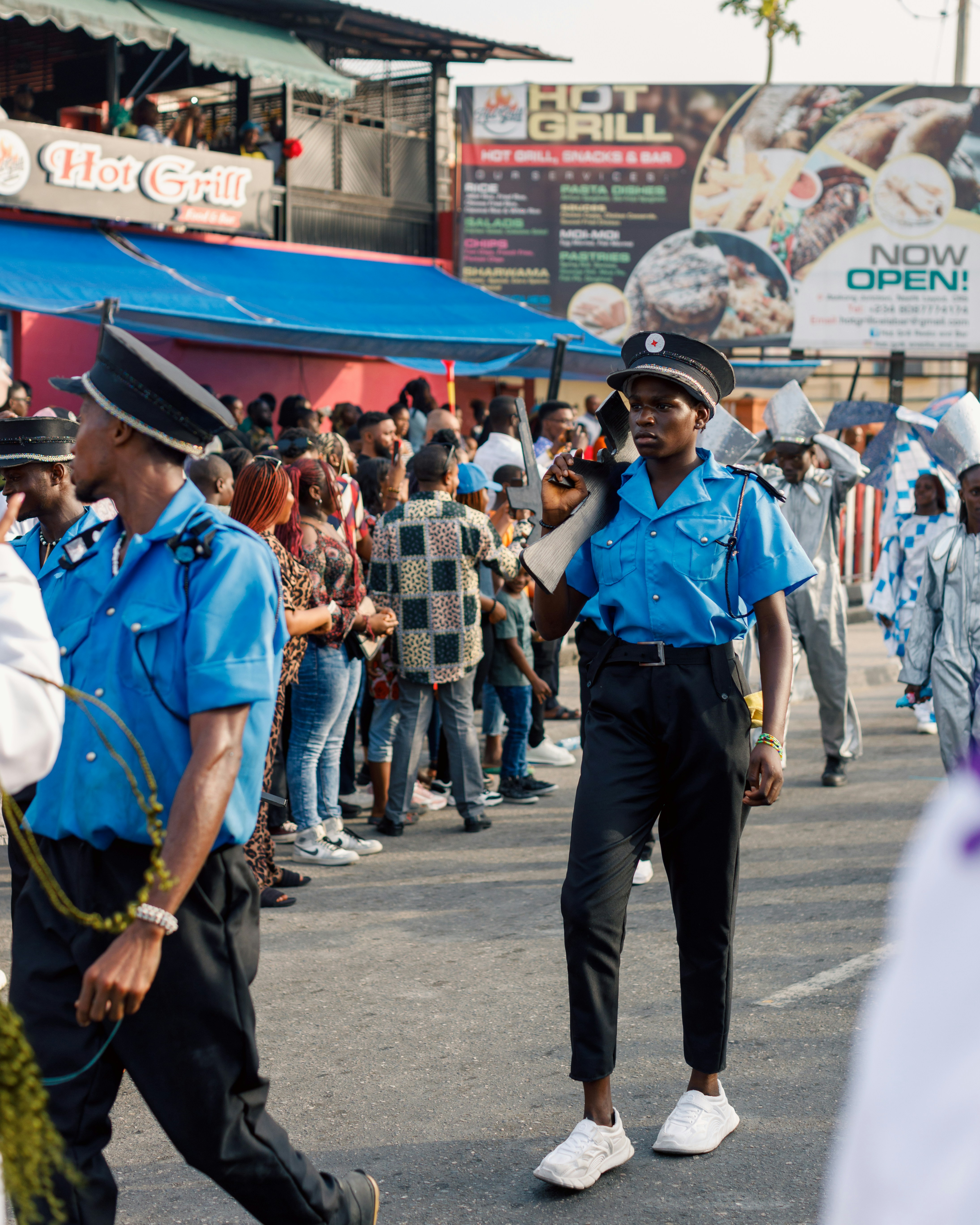 Blue Uniforms in a Crowd: A Security Officer Keeps Watch