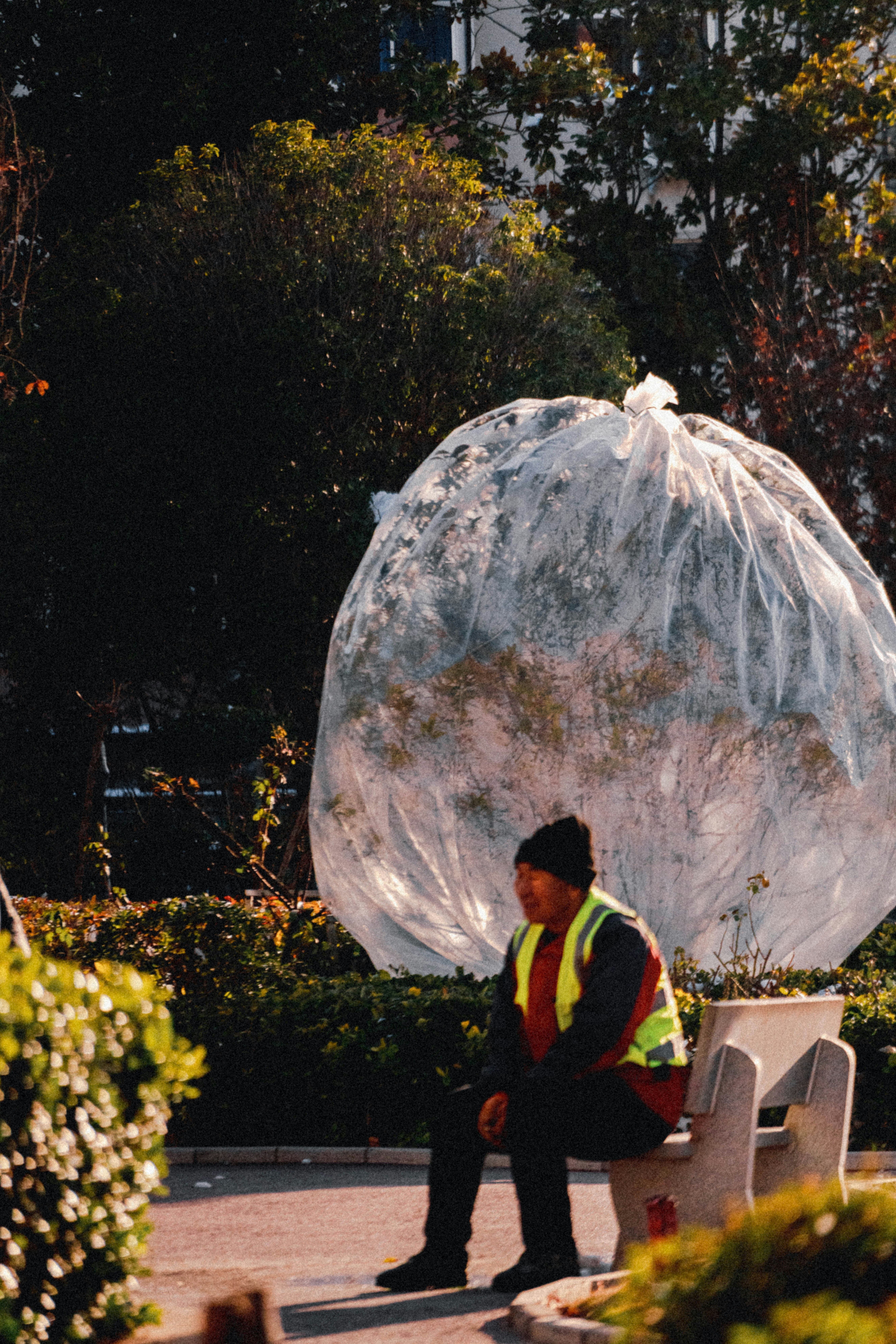 The Behemoth Bubble: City Worker in Front of a Giant Plastic Dome