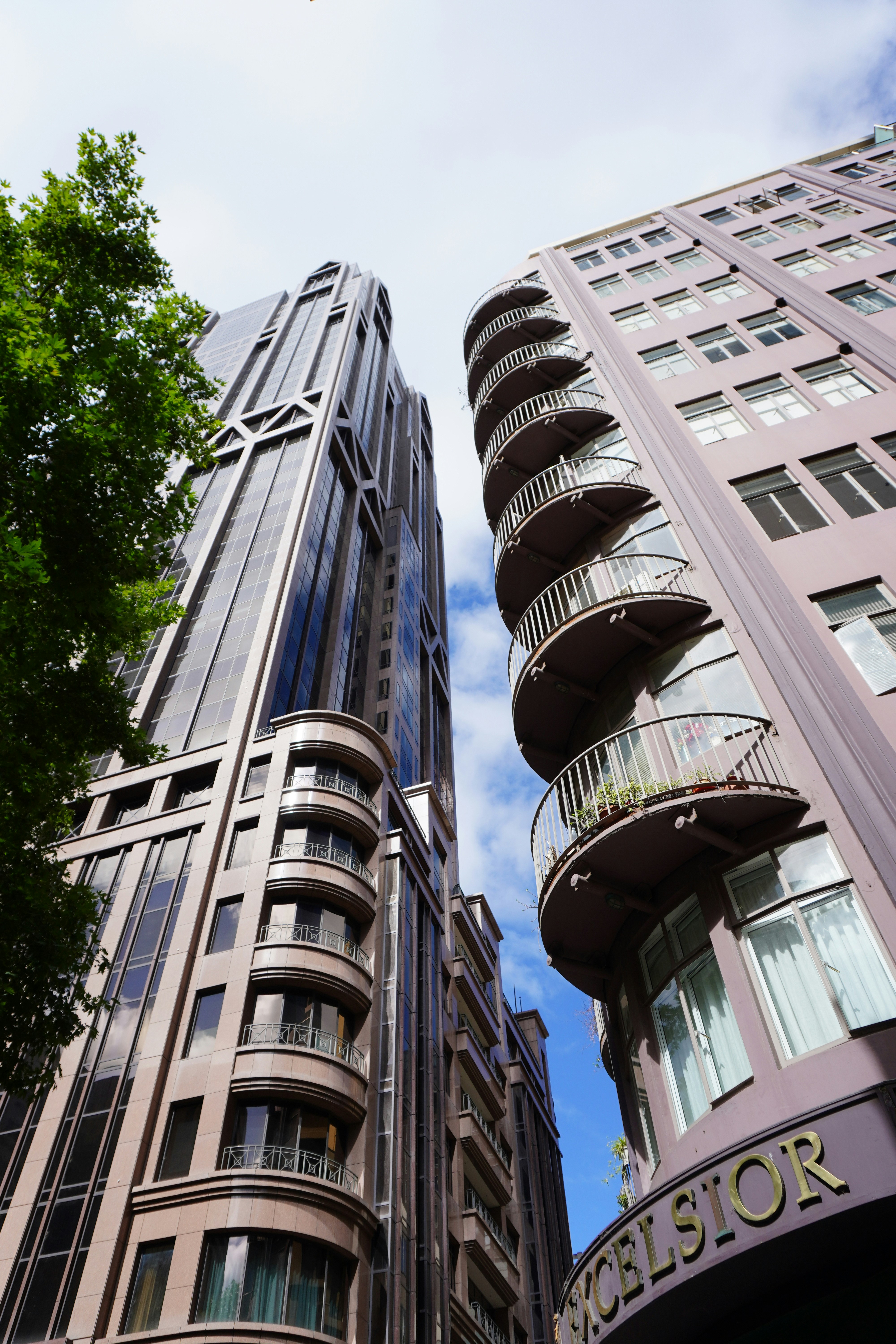 Toward the Sky: Urban Towers Reaching into a Bright Blue Gap